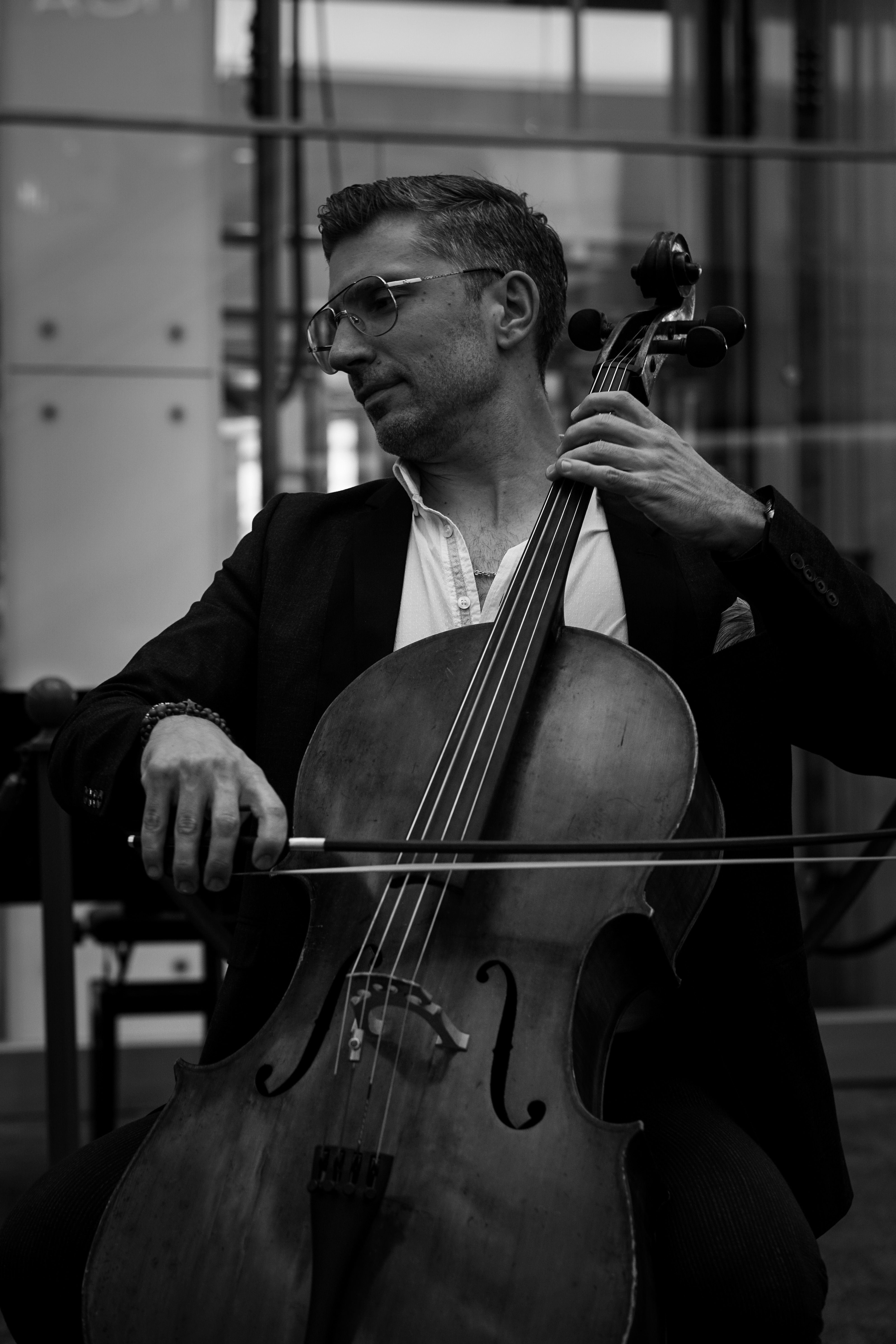 Young Man in Suit Playing on Cello · Free Stock Photo