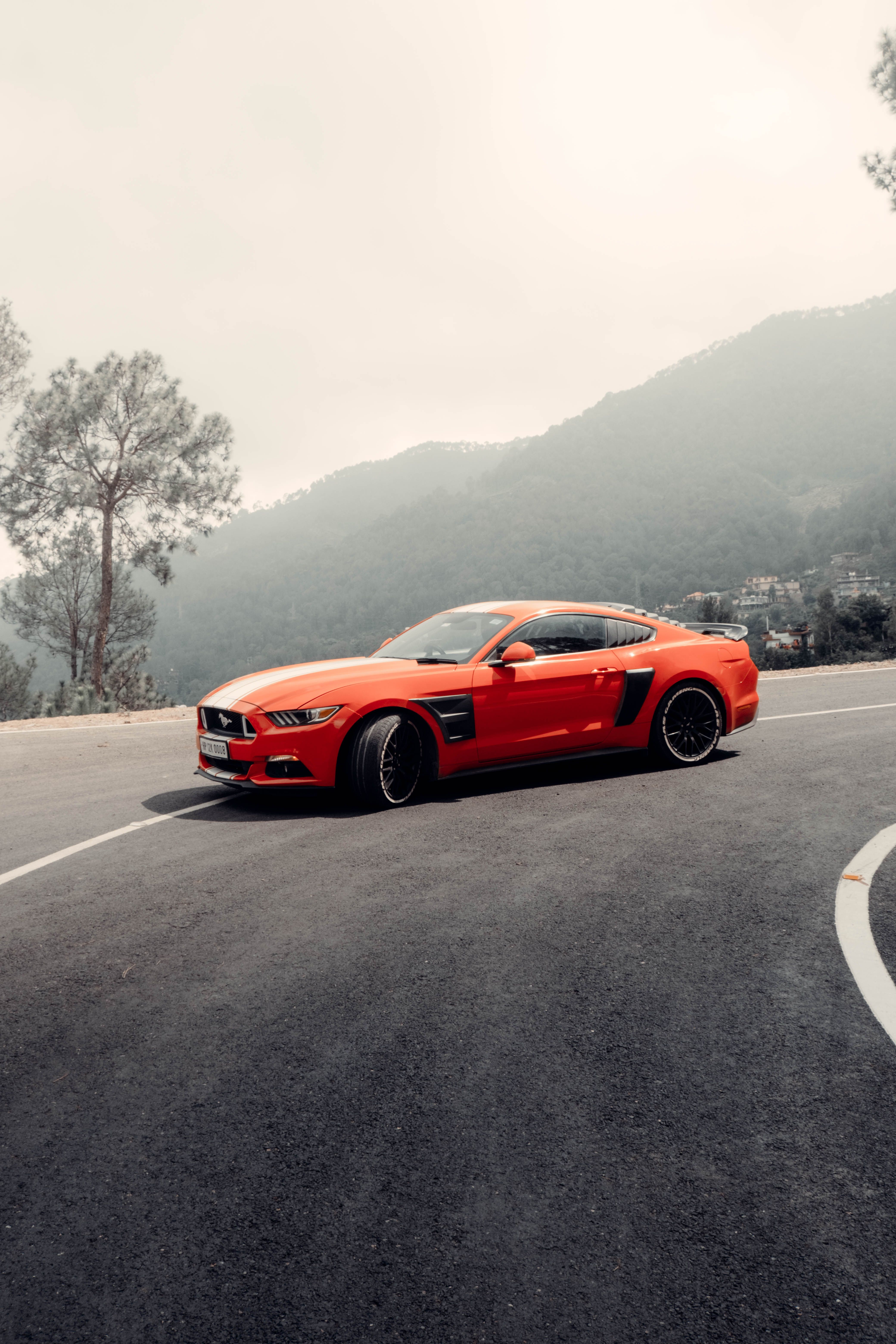A Red Ford Mustang GT on a Street · Free Stock Photo