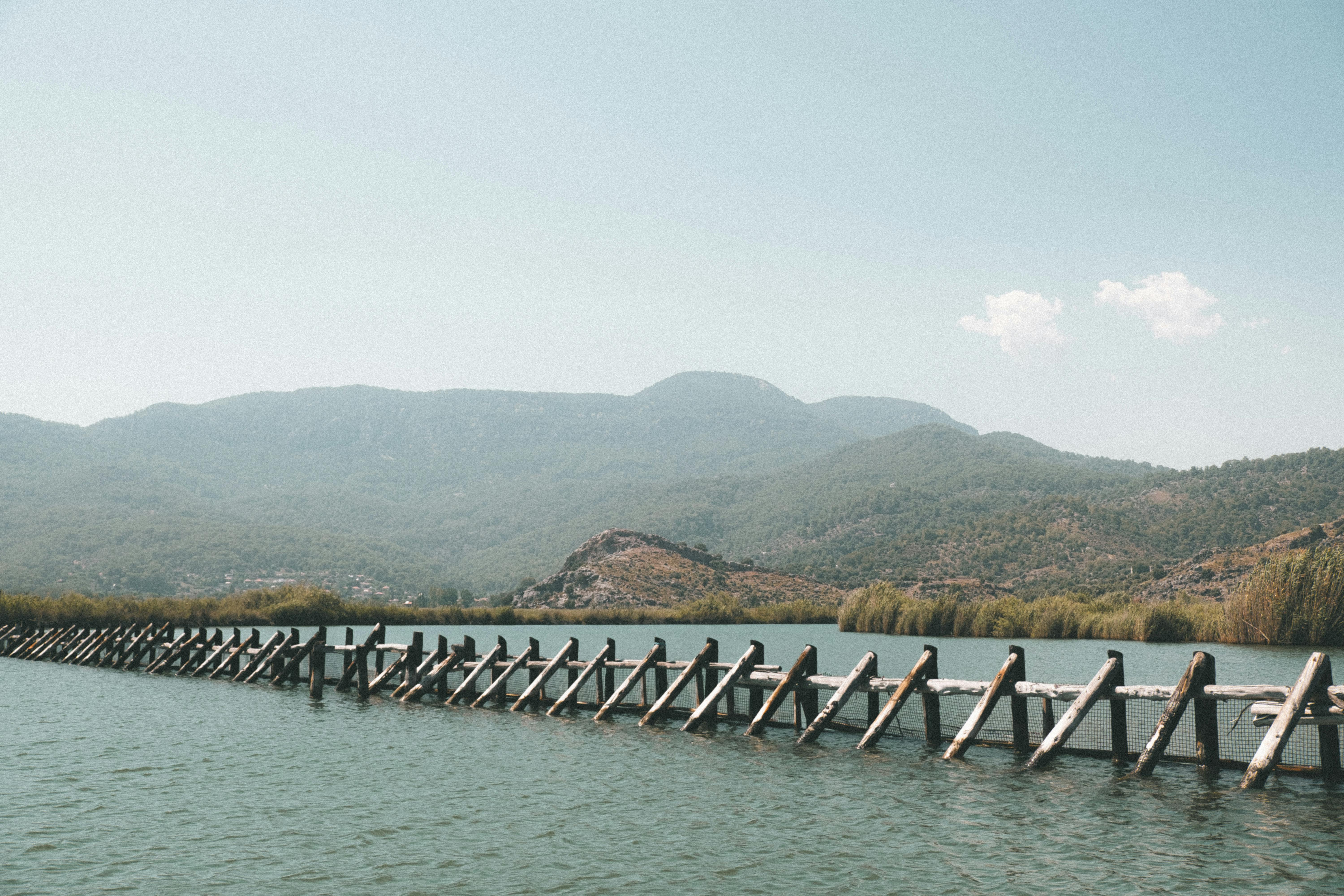 Wooden Dam in a Lake in a Mountain Valley · Free Stock Photo