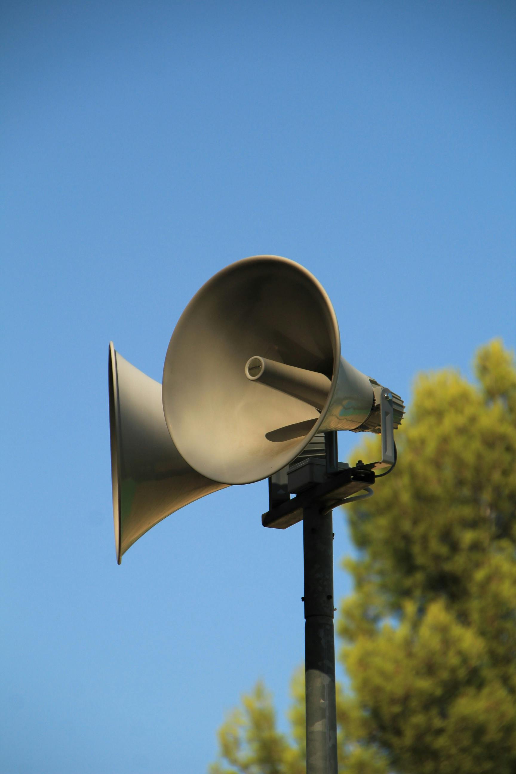 Two Megaphones on a Blue Sky · Free Stock Photo