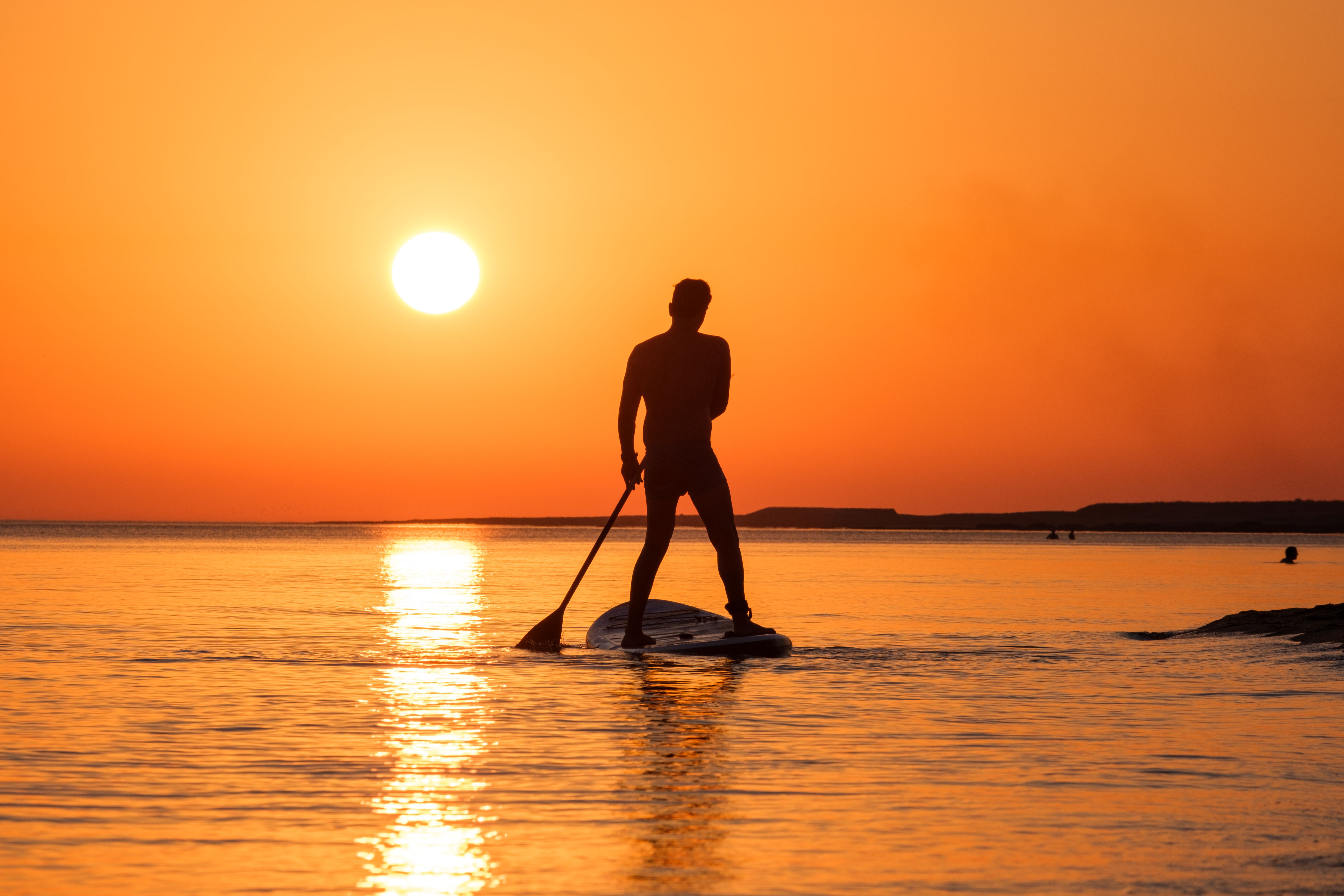 Man Paddling on a Board · Free Stock Photo