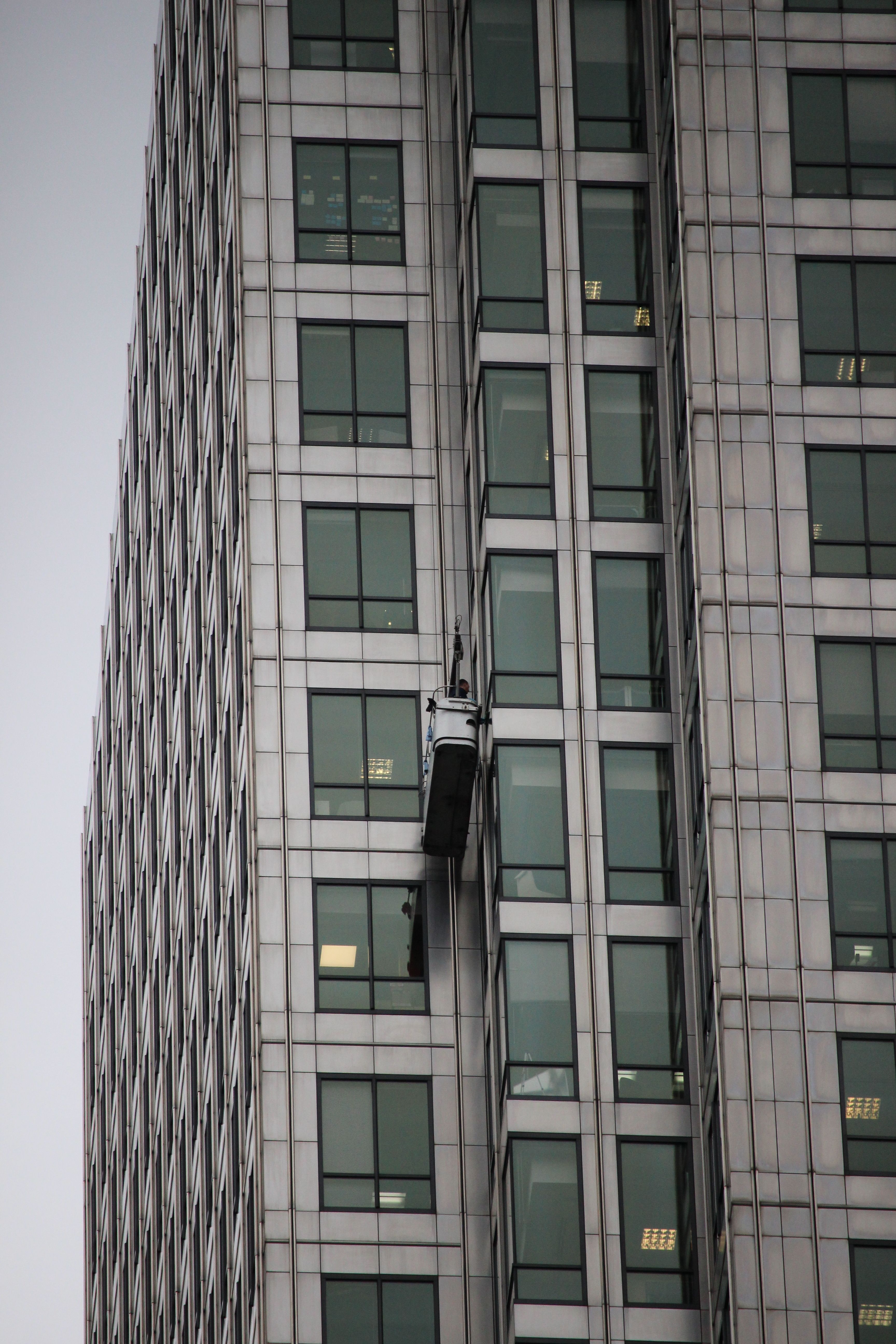 Cleaners on Window Cleaning Platform at Skyscraper · Free Stock Photo