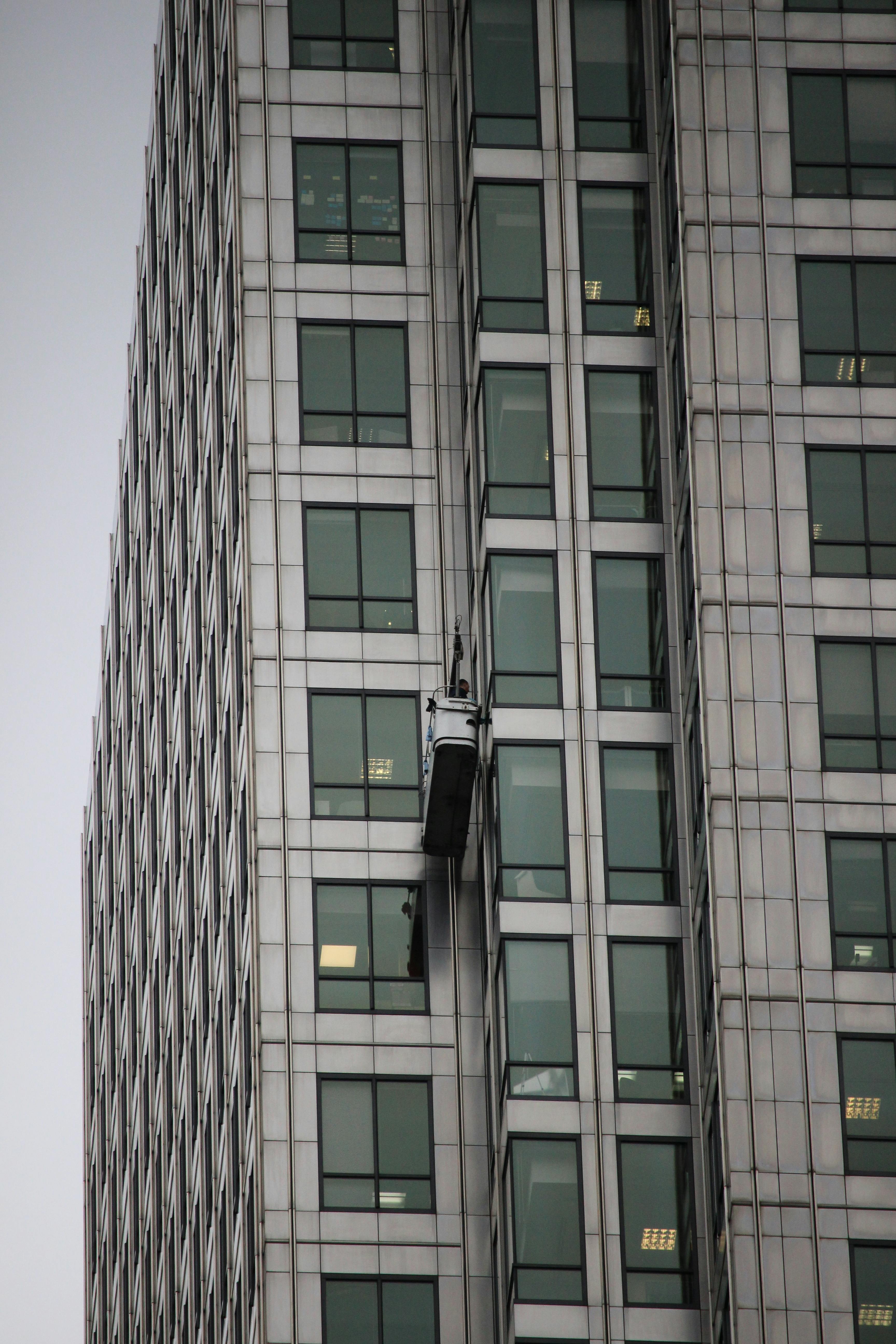 Cleaners on Window Cleaning Platform at Skyscraper · Free Stock Photo