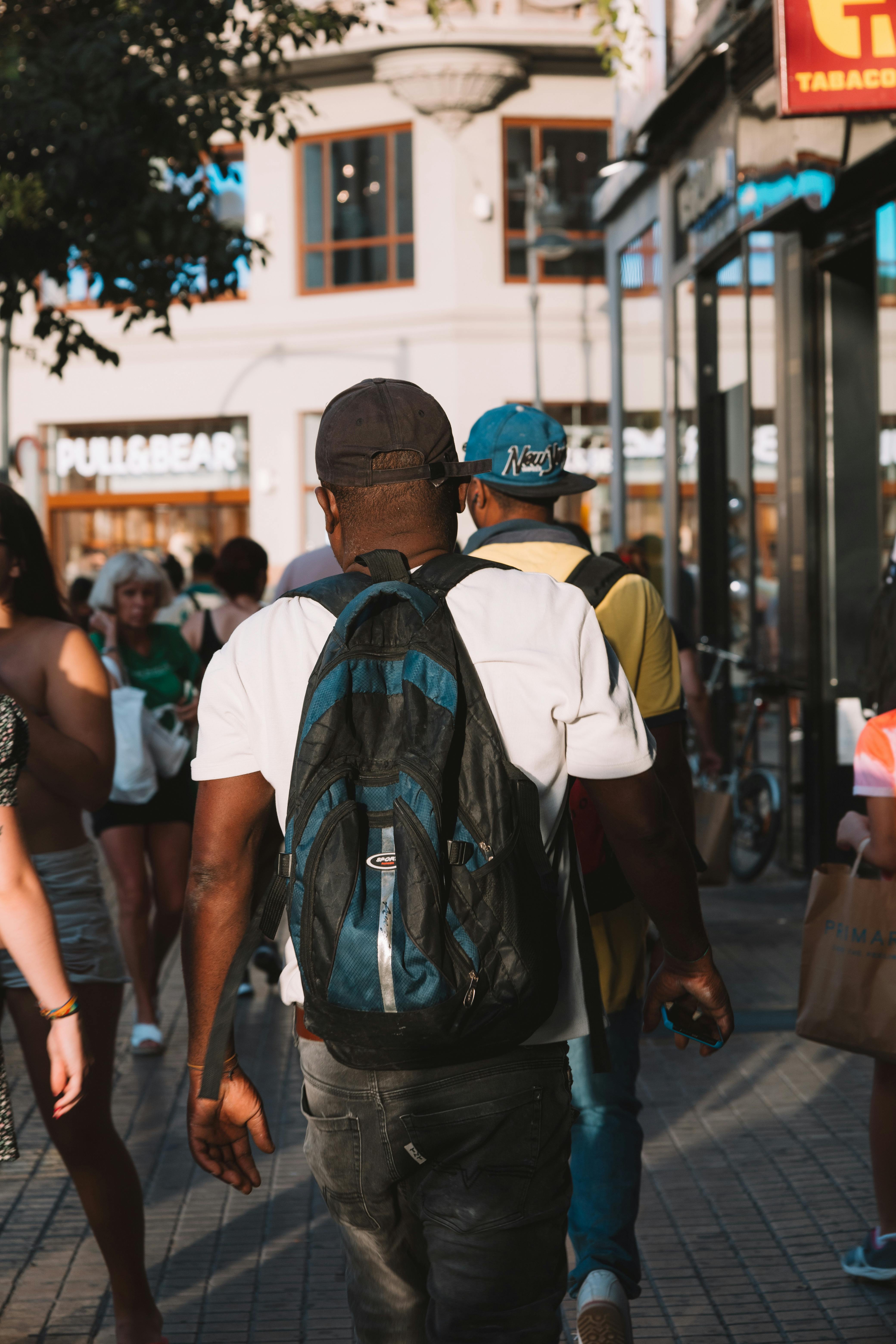 Man Walking among People in Town · Free Stock Photo
