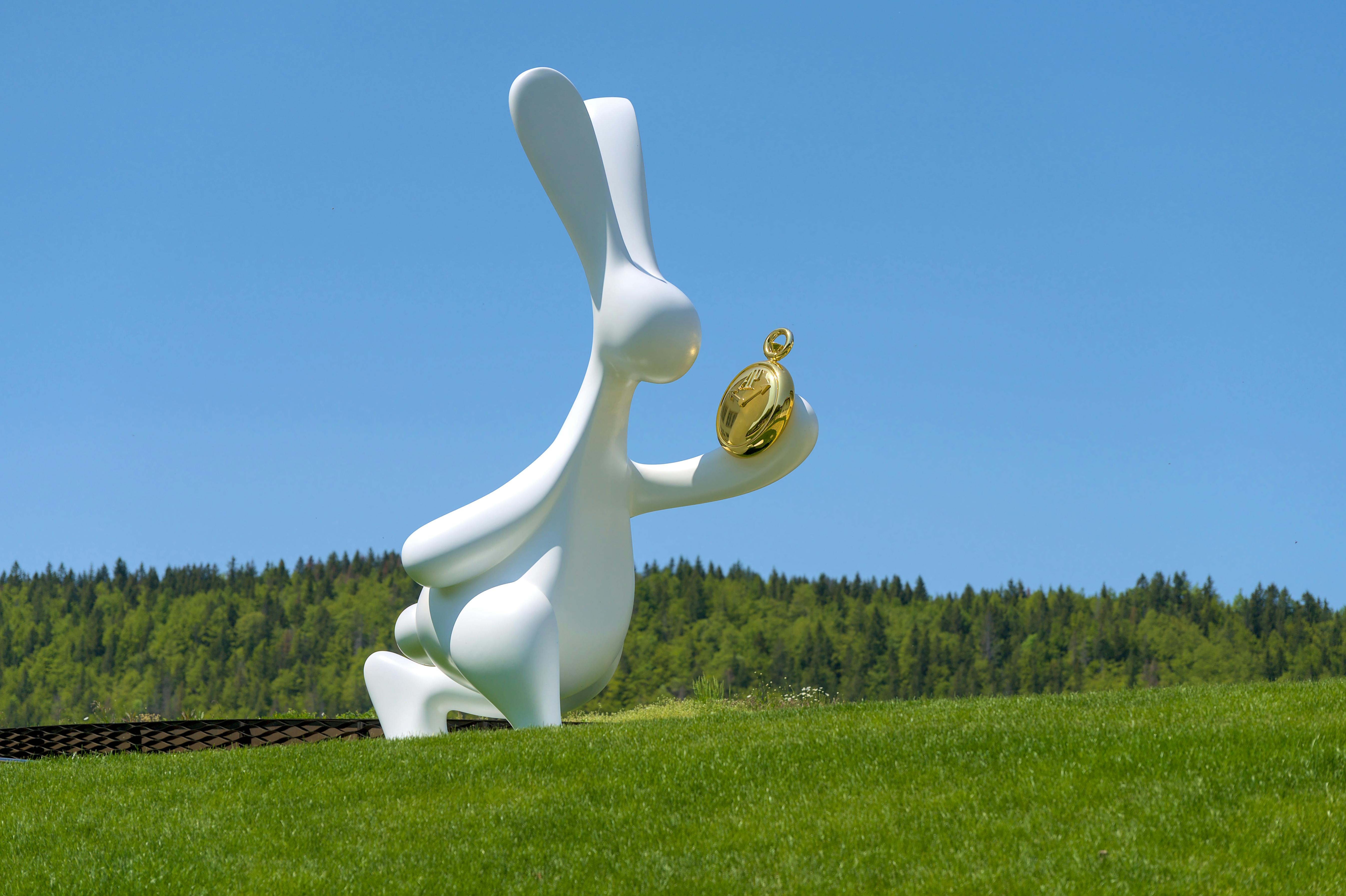 White Rabbit Holding Gold Frame Pocket Watch Statue · Free Stock Photo