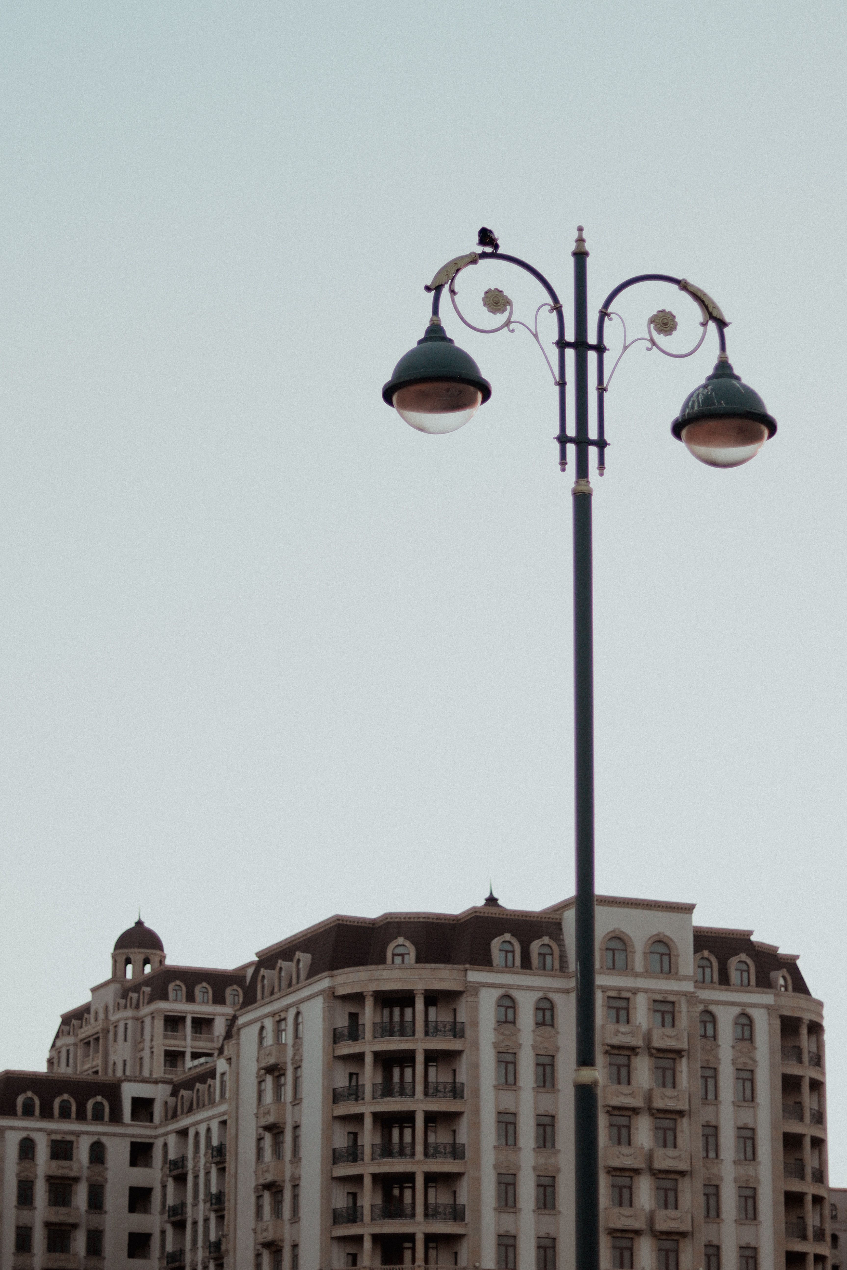 Street Lamp and Building in Town behind · Free Stock Photo