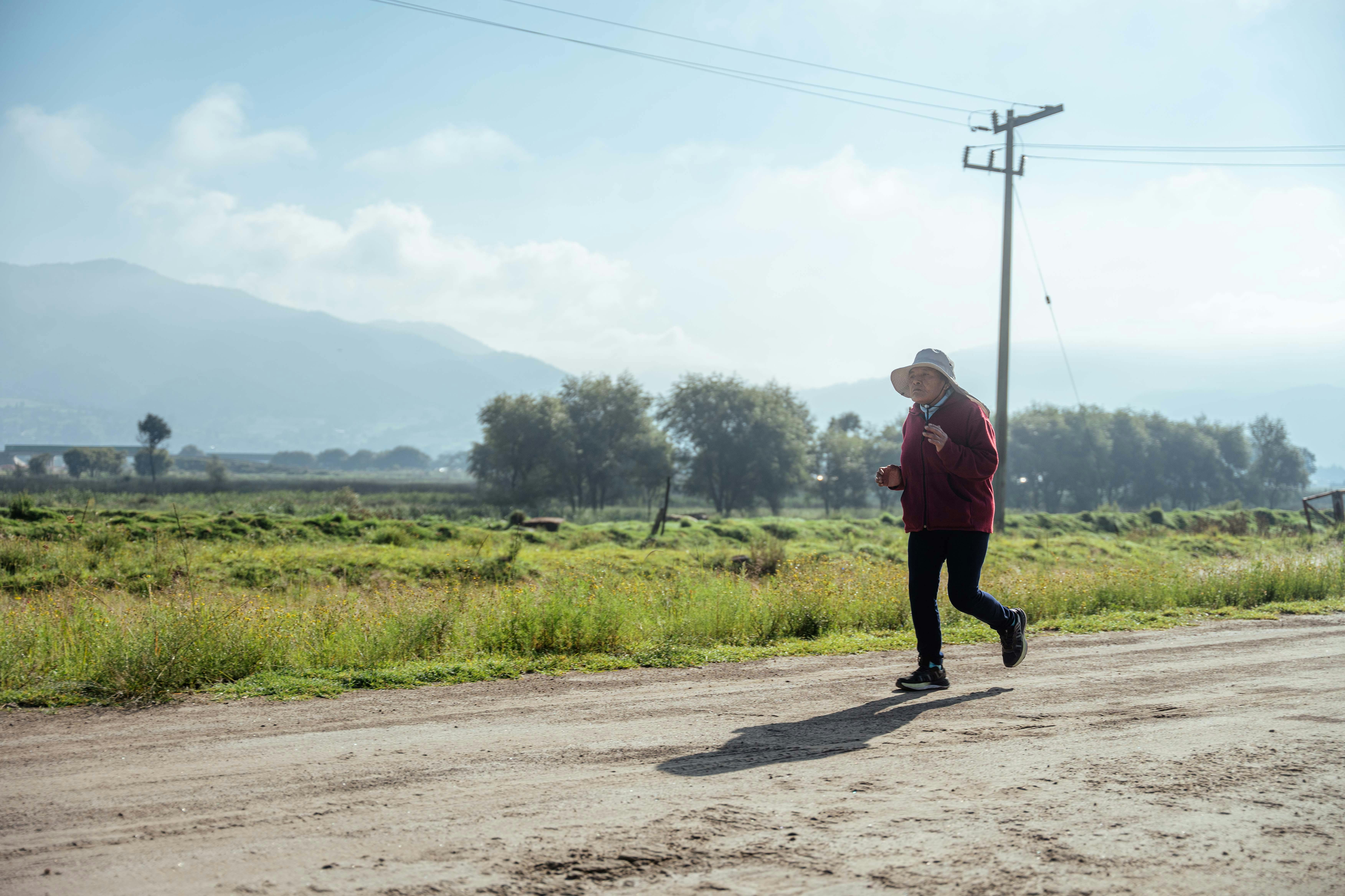 Men Running in a Marathon in the Countryside · Free Stock Photo