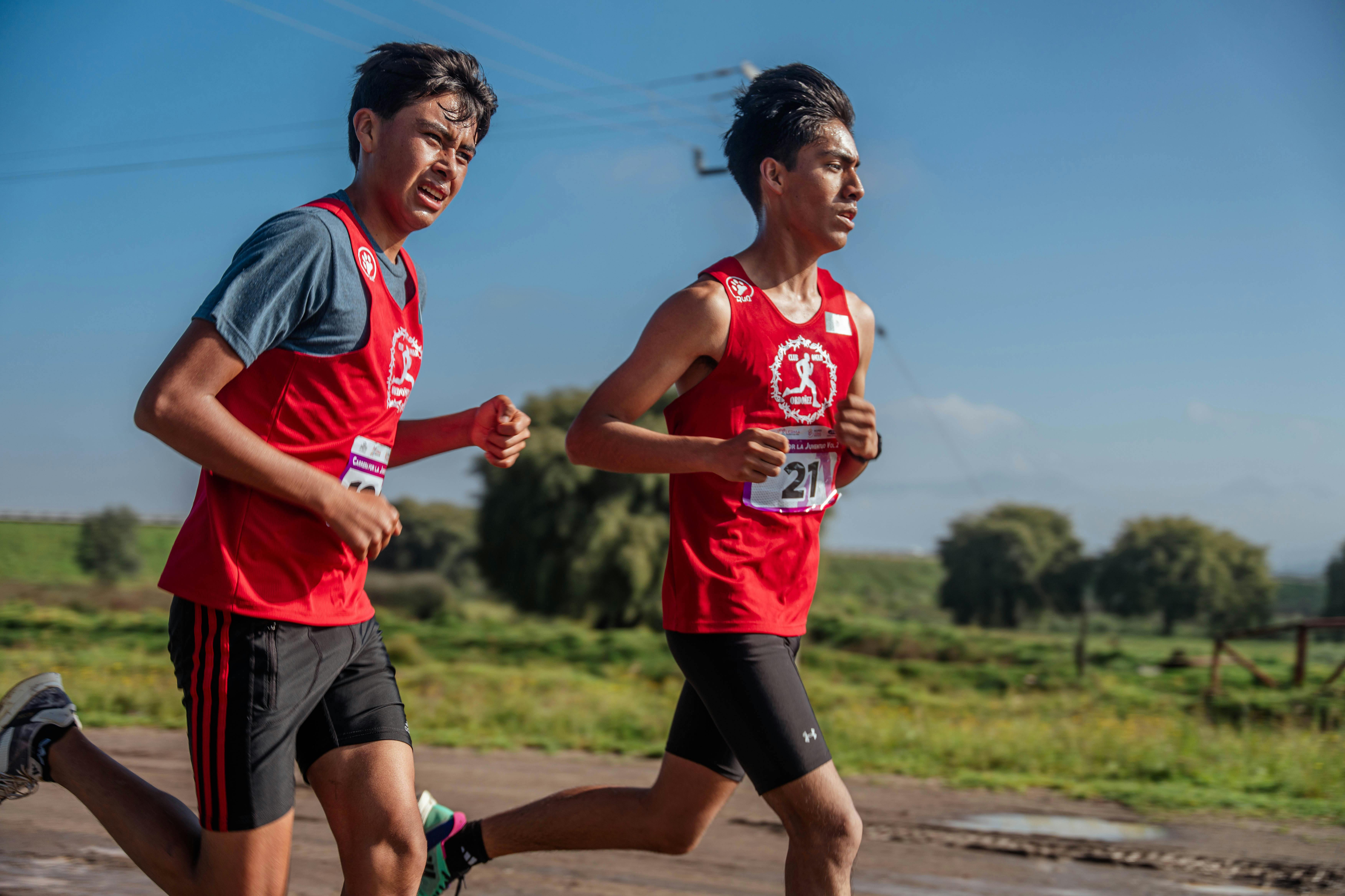 Men Running in a Marathon in the Countryside · Free Stock Photo