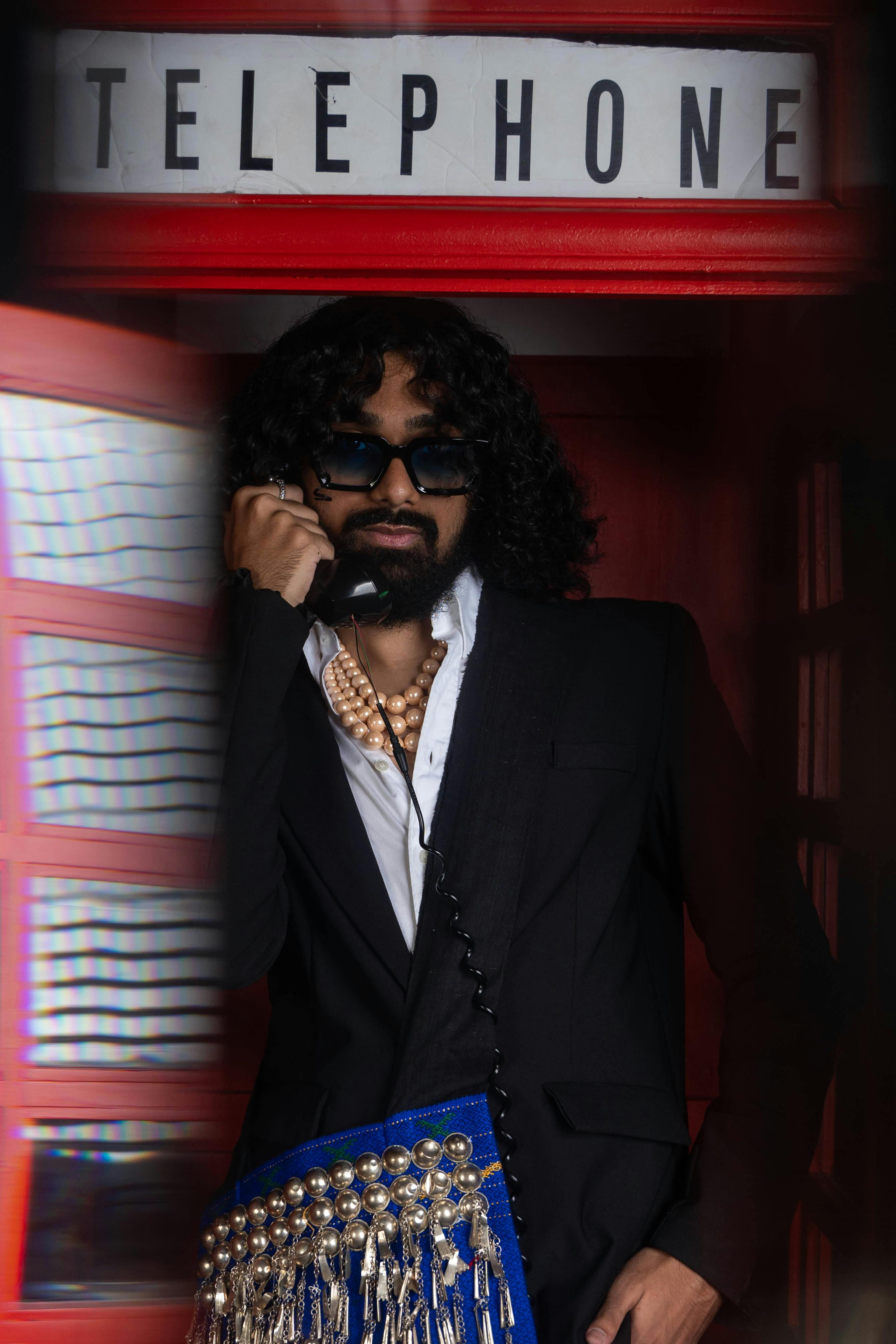 Man in Telephone Booth · Free Stock Photo