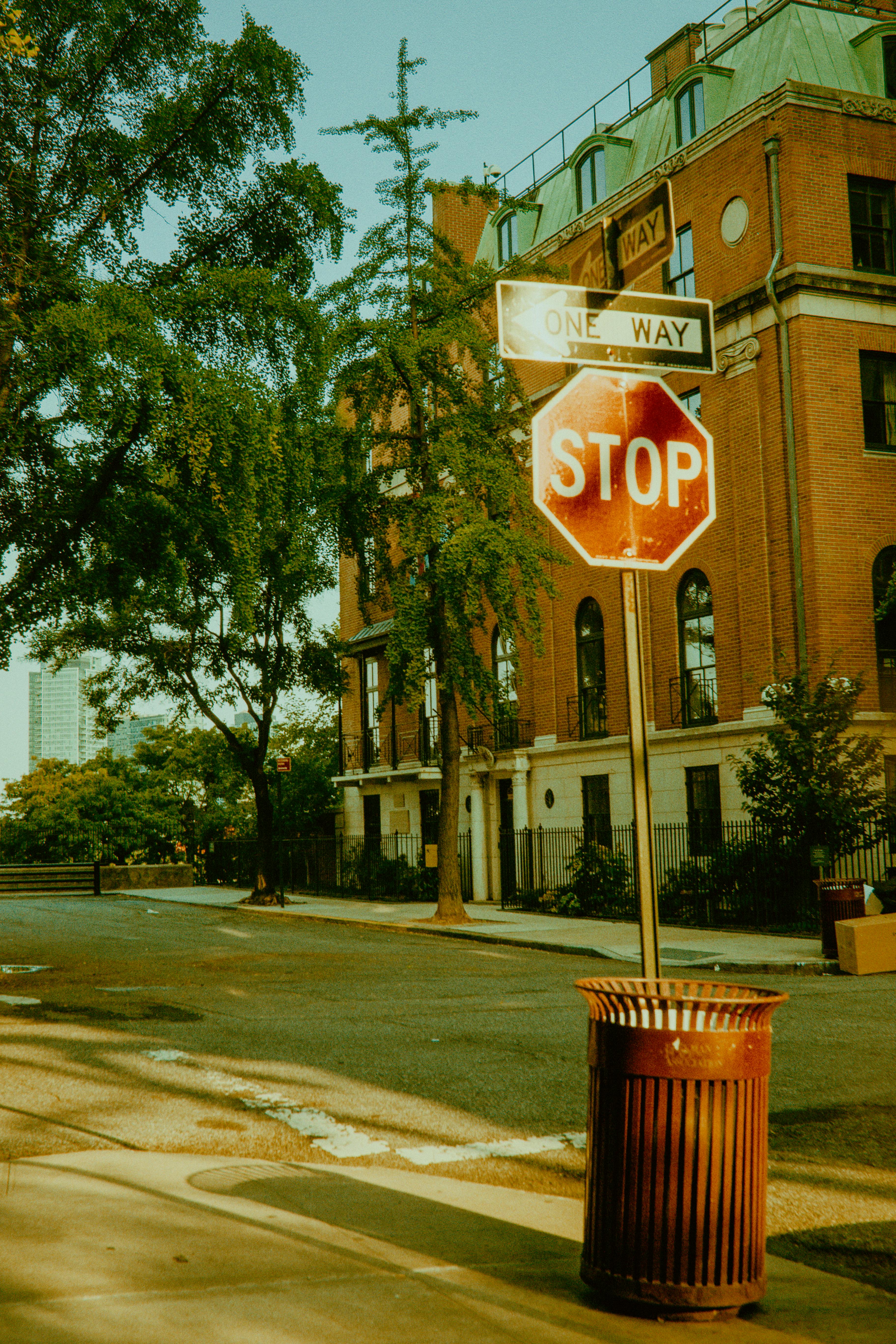 Stop Sign behind Green Bushes · Free Stock Photo