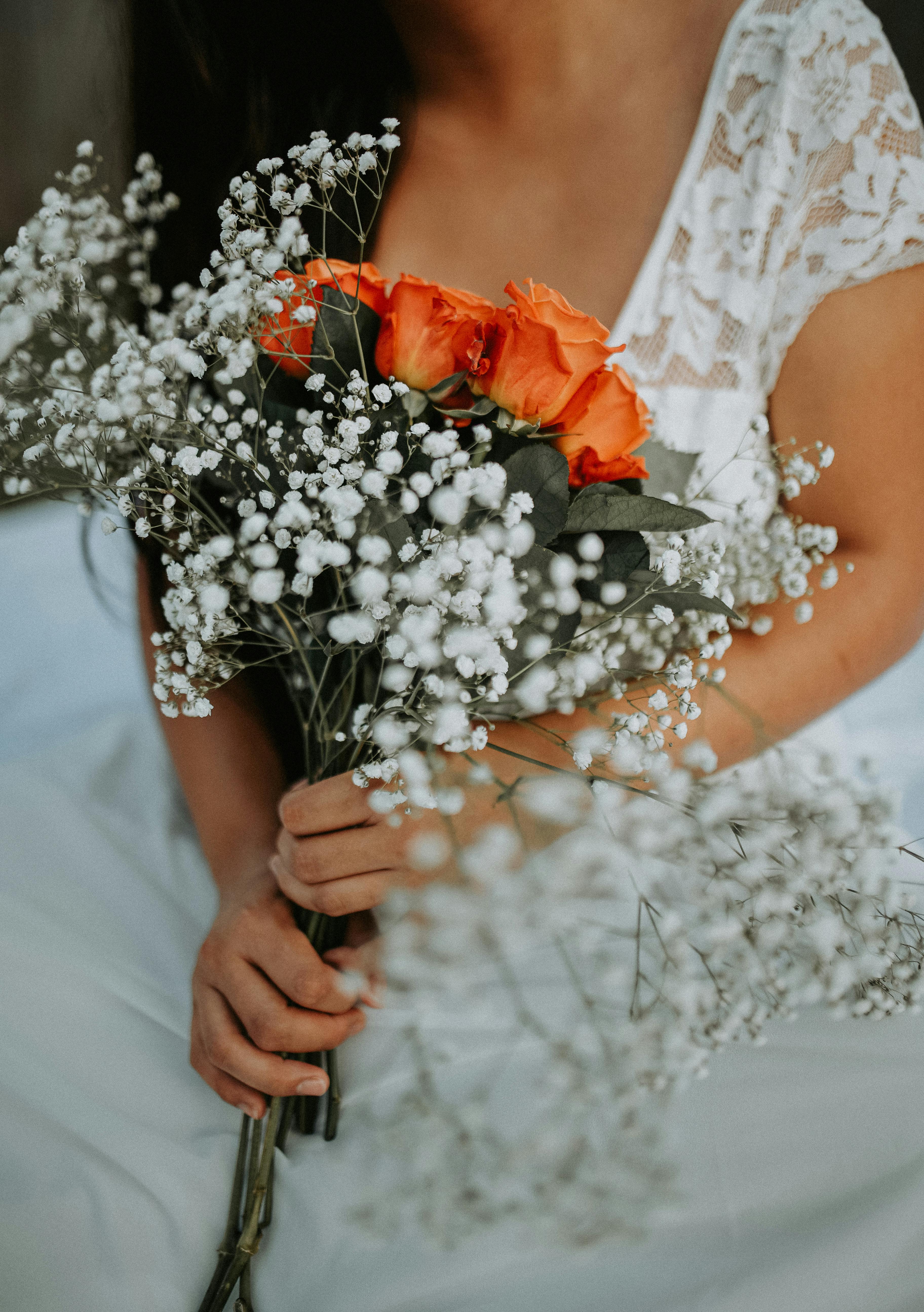 Bride Holding Flowers Bouquet · Free Stock Photo