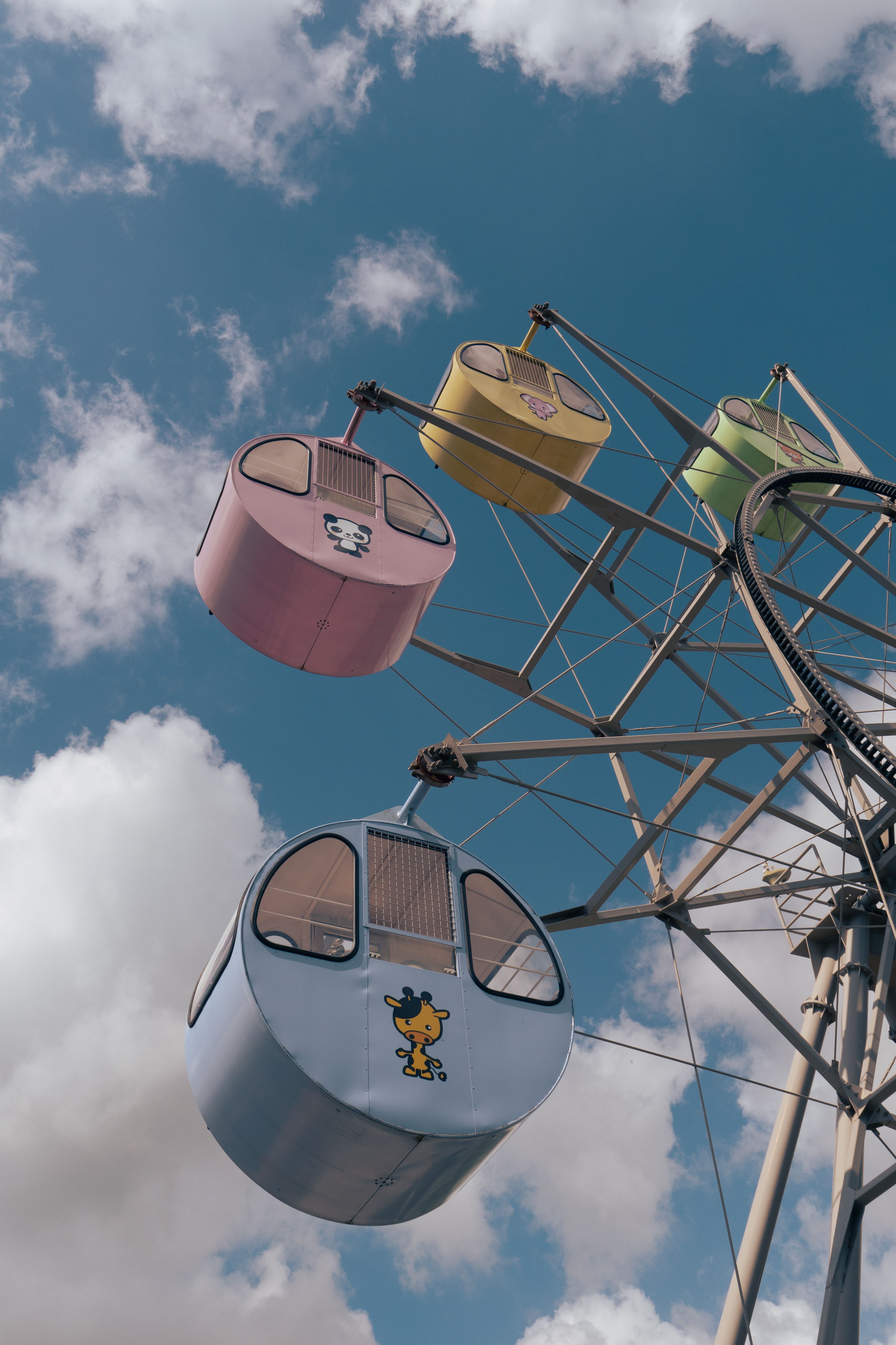 Ferris wheel with colorful cartoon characters on it · Free Stock Photo