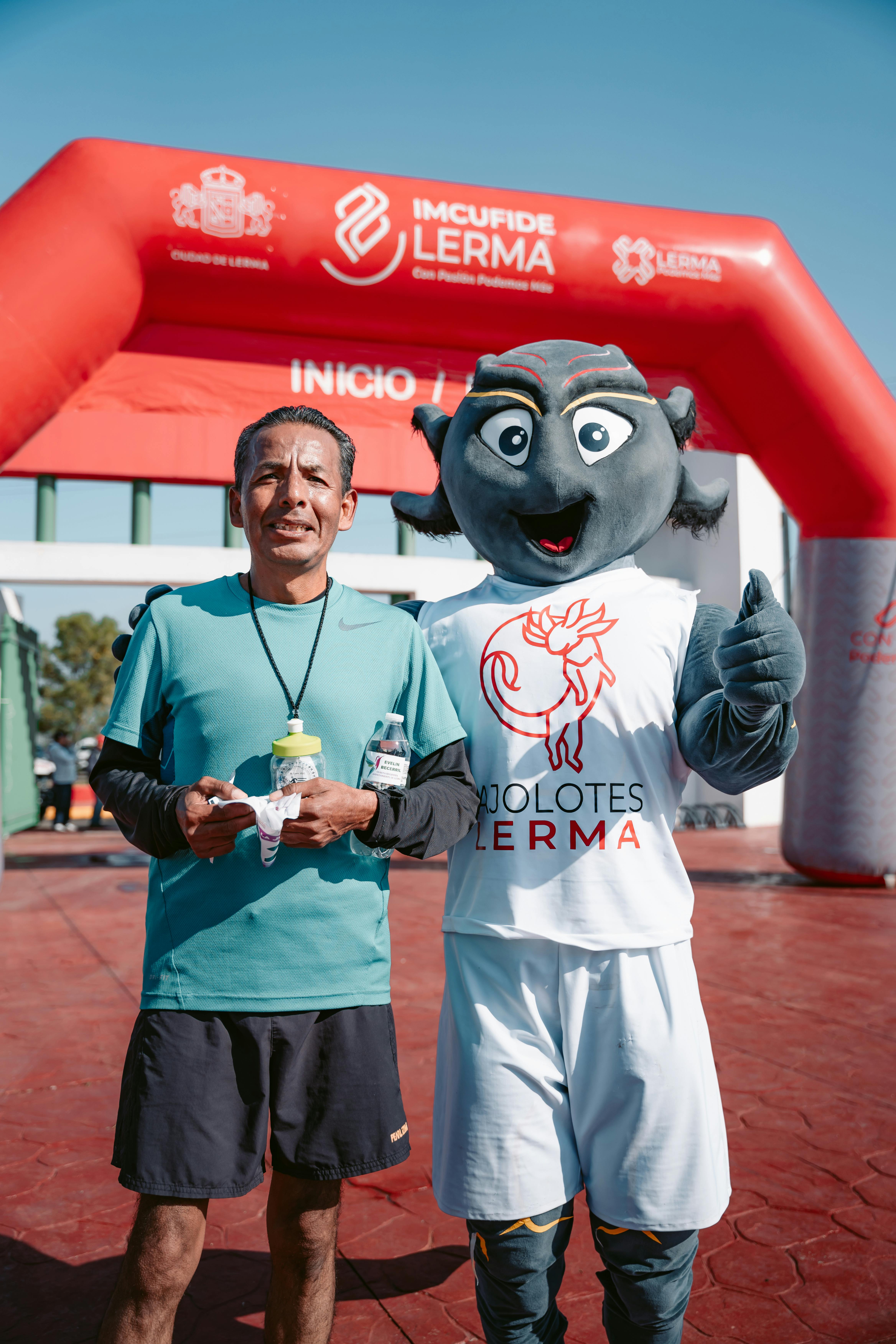 Runner Standing with Mascot after Run · Free Stock Photo