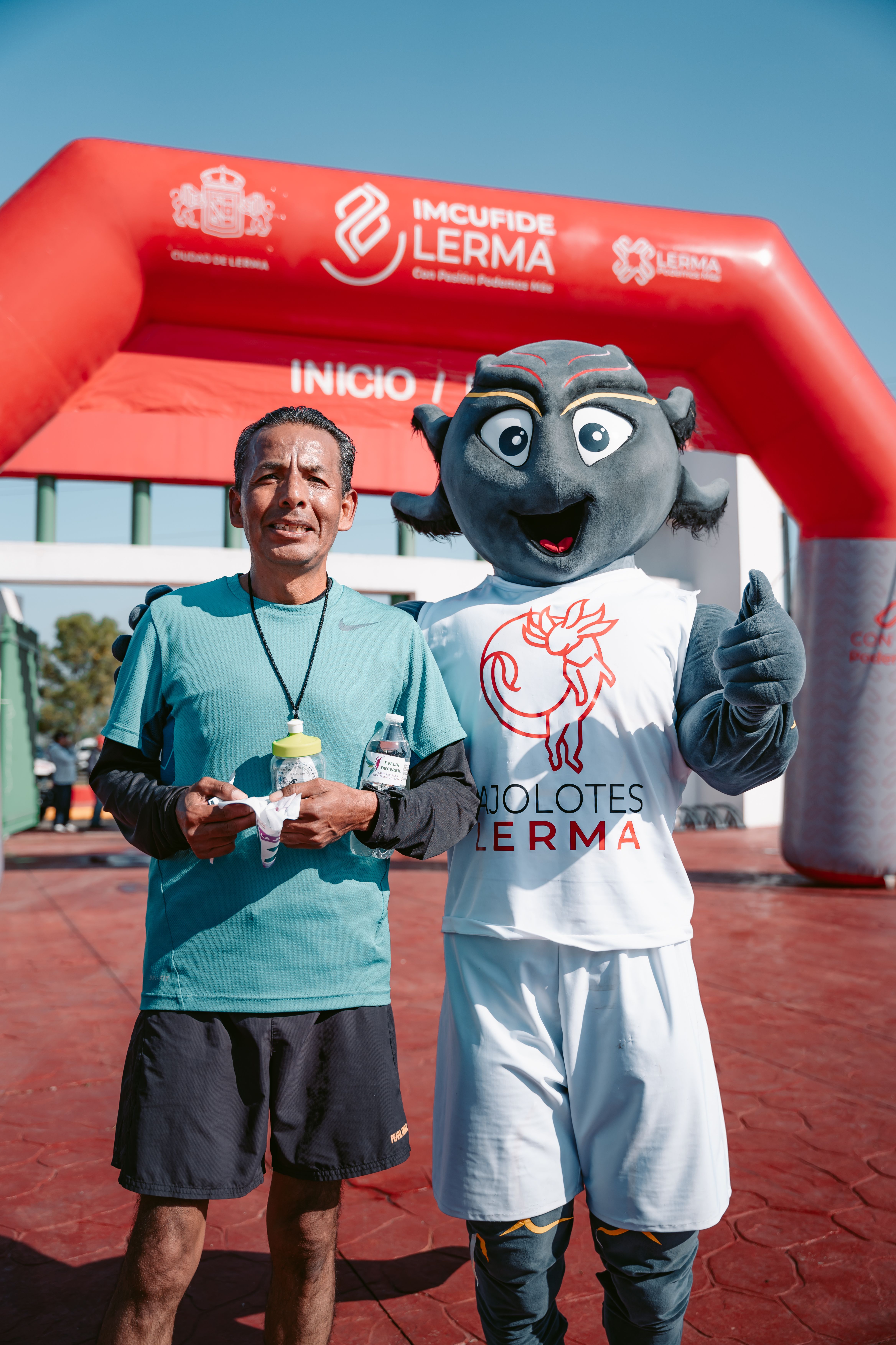 Runner Standing with Mascot after Run · Free Stock Photo
