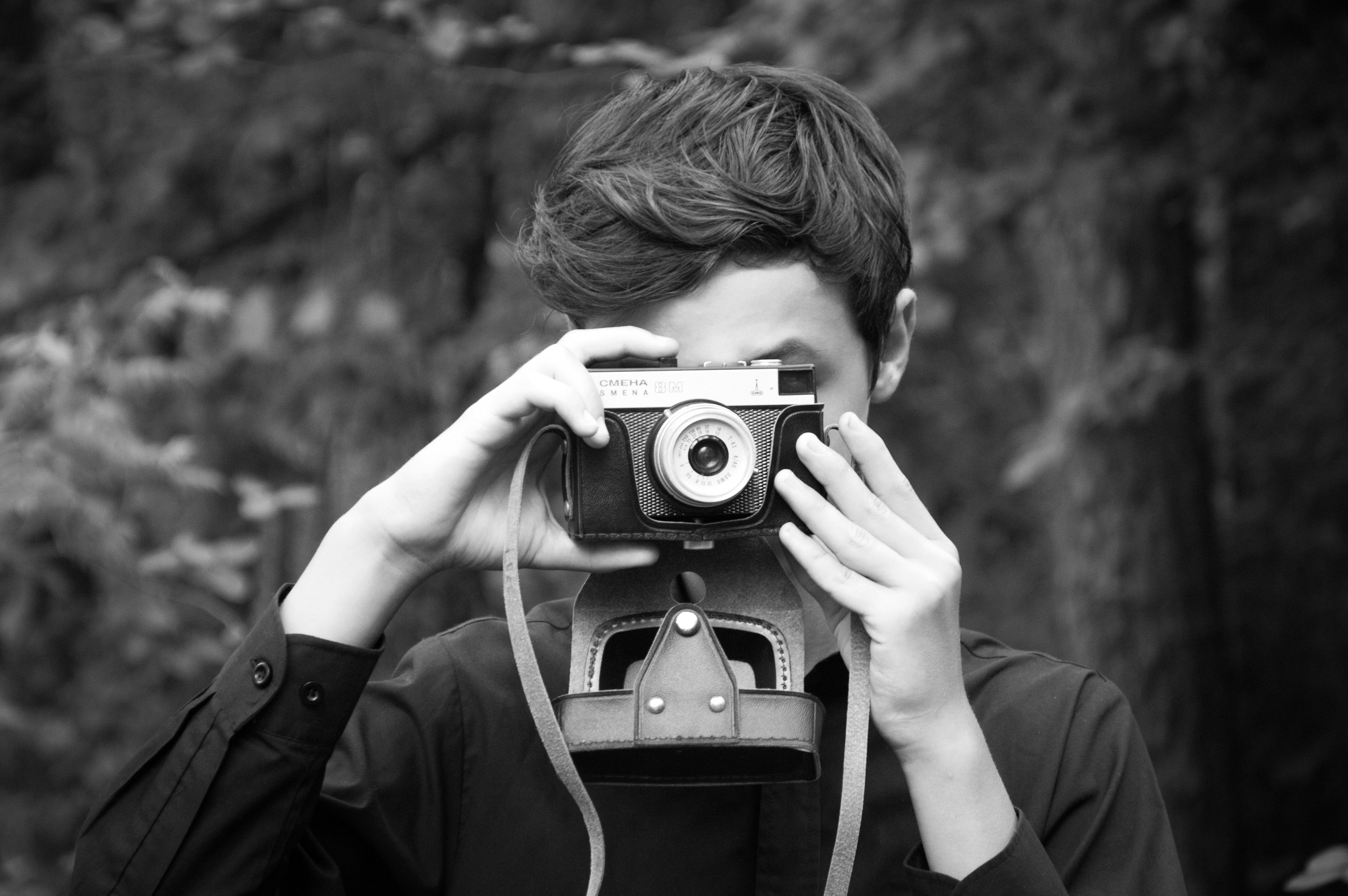 Black and White Photo of a Boy with an Analogue Camera in a Forest ...