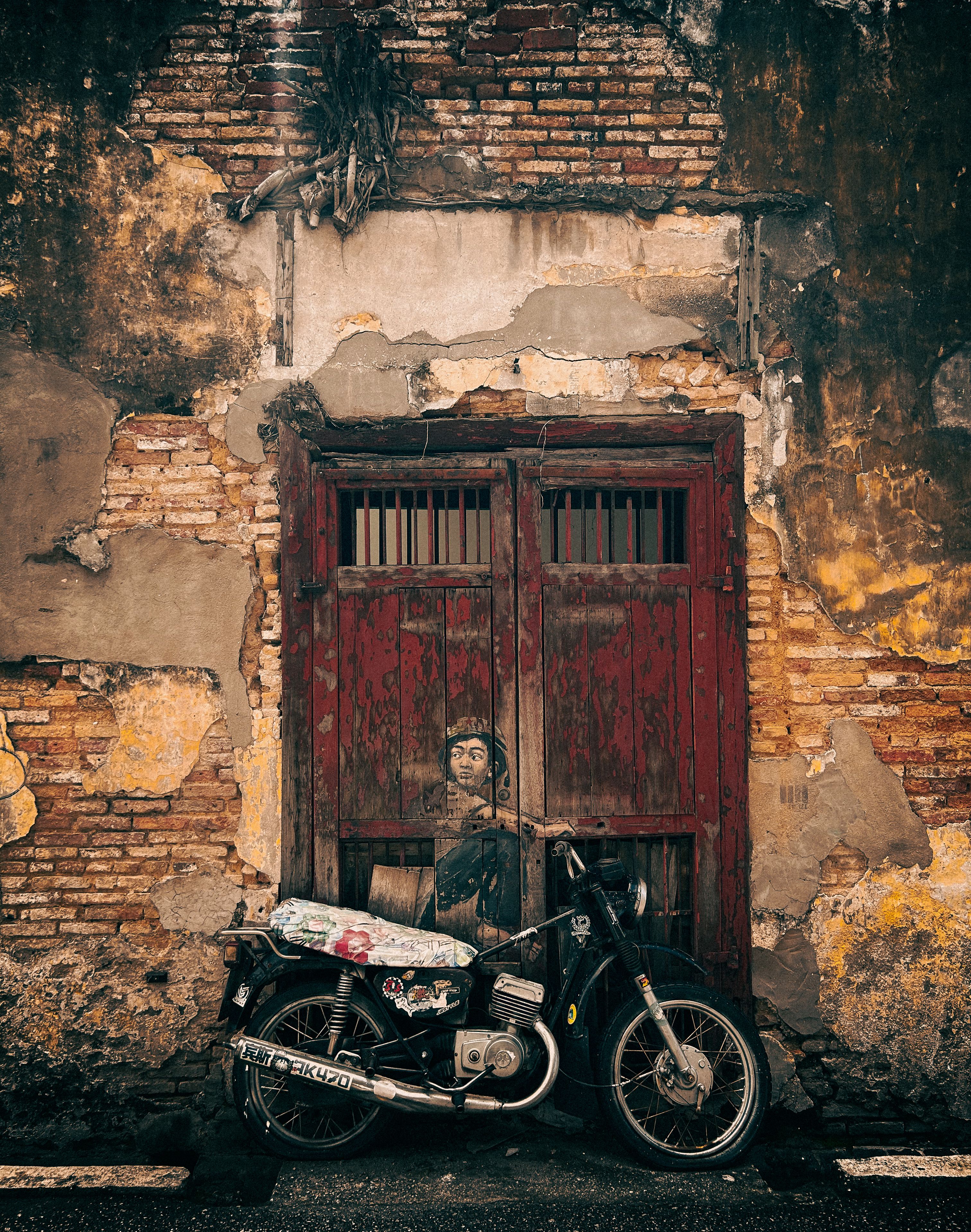 Motorbike near Destroyed Wall · Free Stock Photo