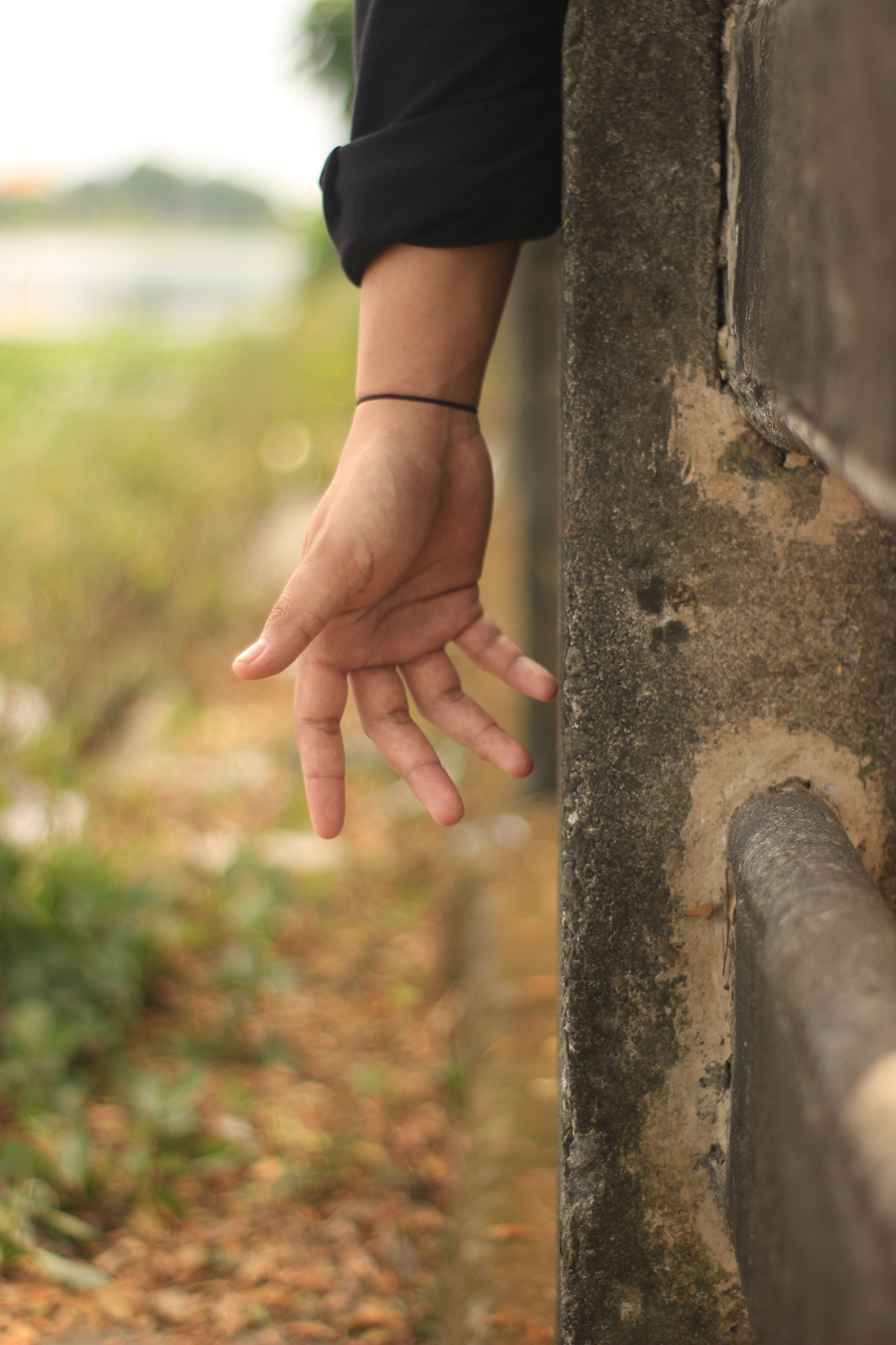 Hand Hanging on Railing · Free Stock Photo