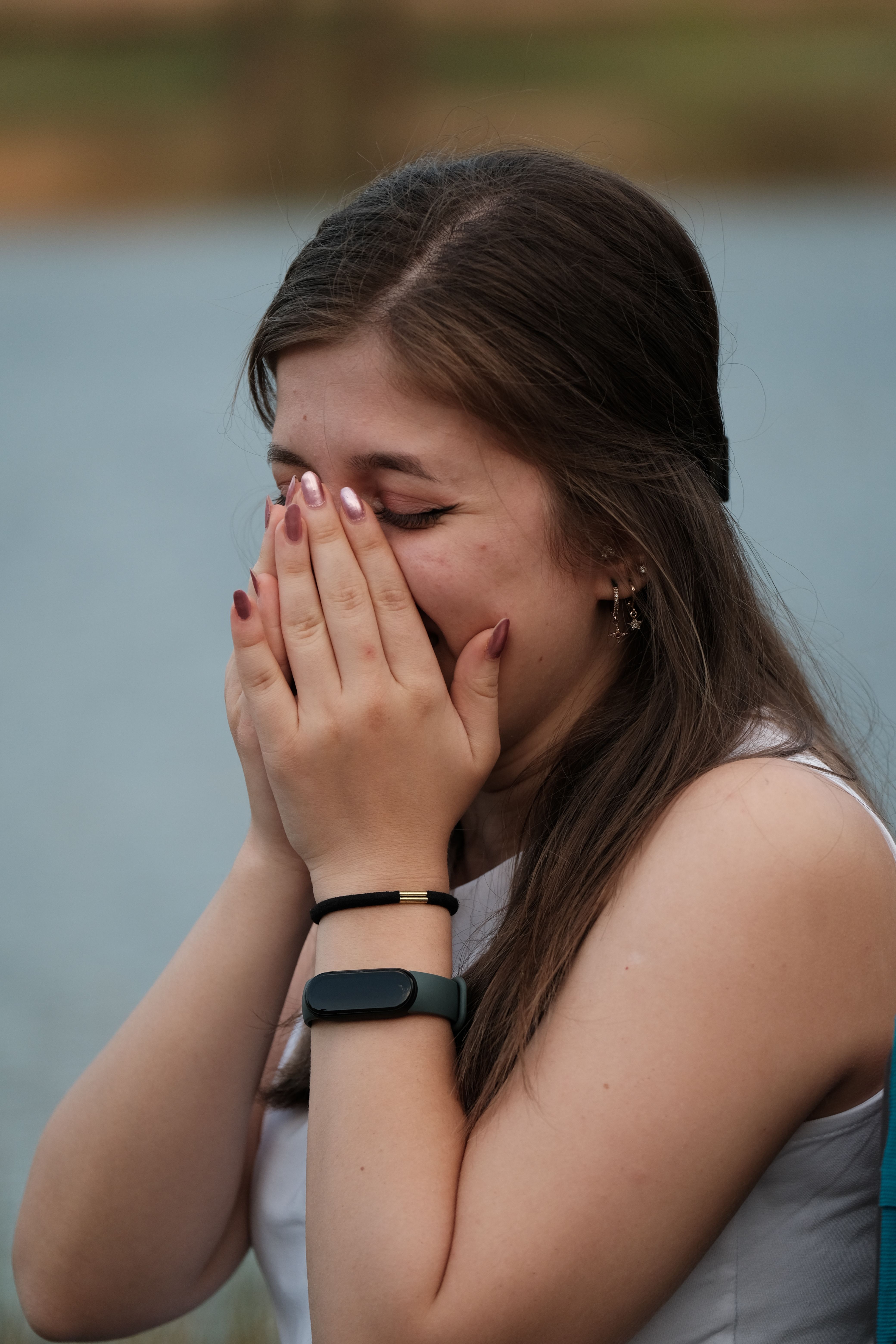 Woman Laughing with Hands on Face · Free Stock Photo