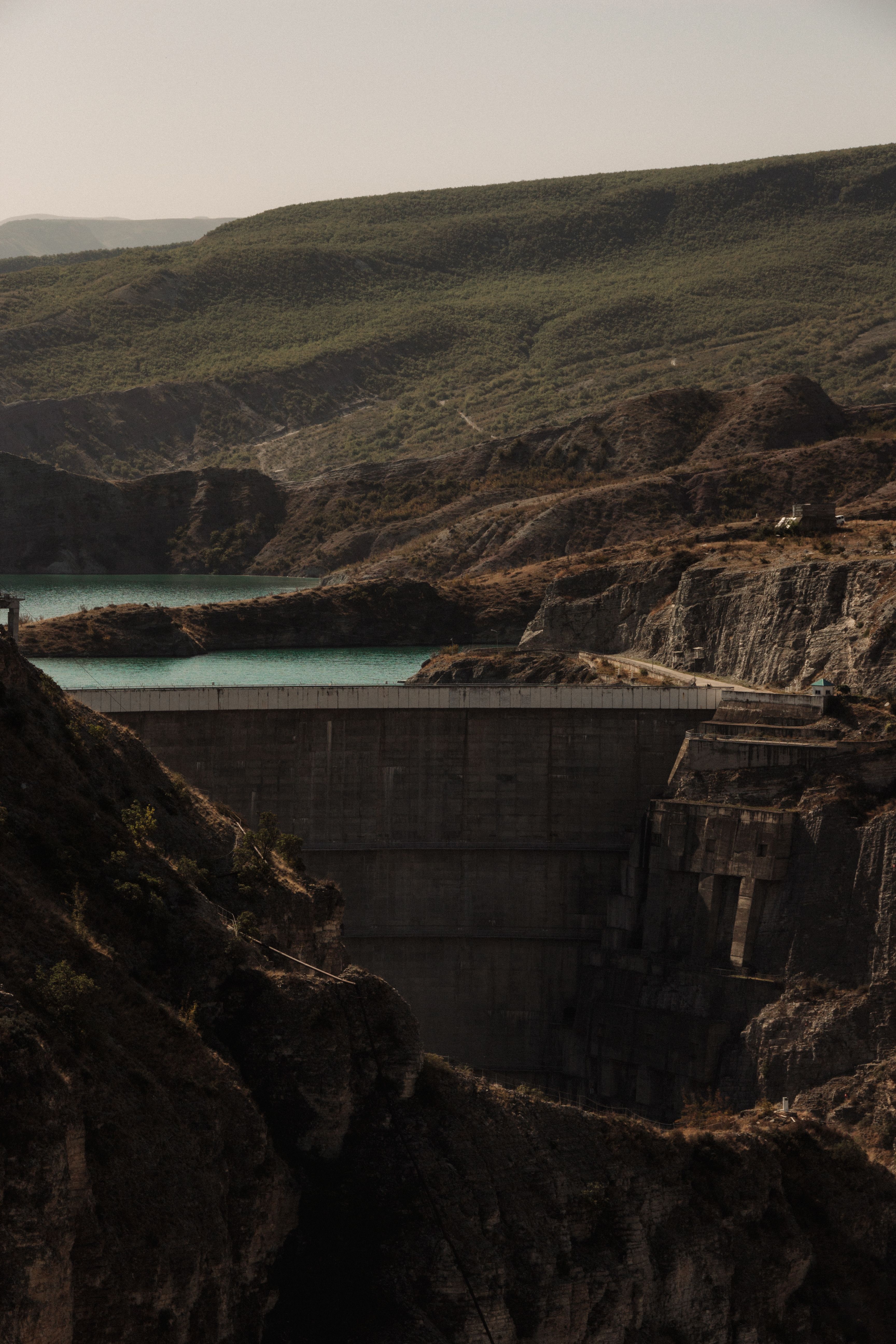View of a Water Dam on a Reservoir in Hills · Free Stock Photo
