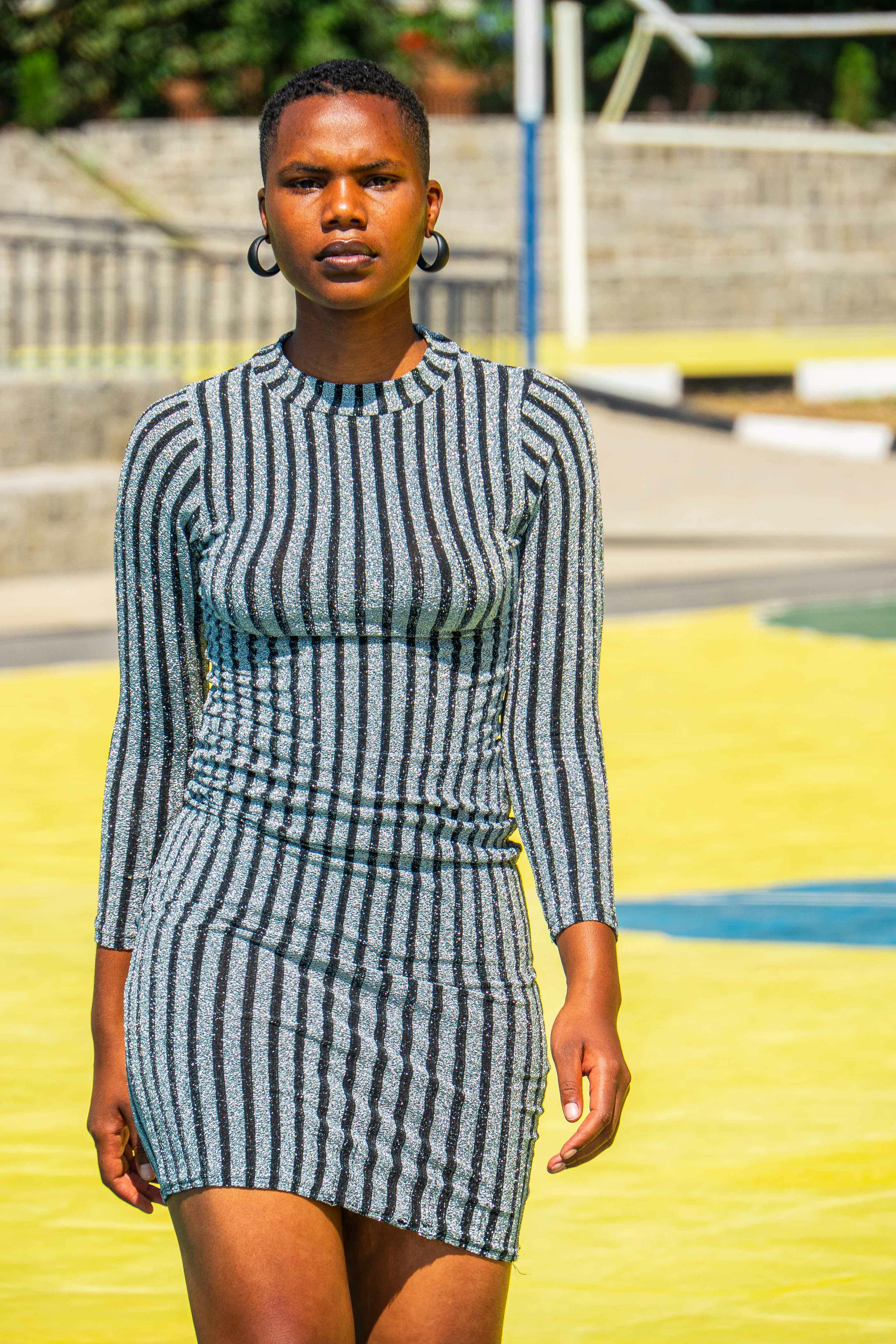 A Low Angle View of a Female Model Holding a Tennis Racket Towards ...