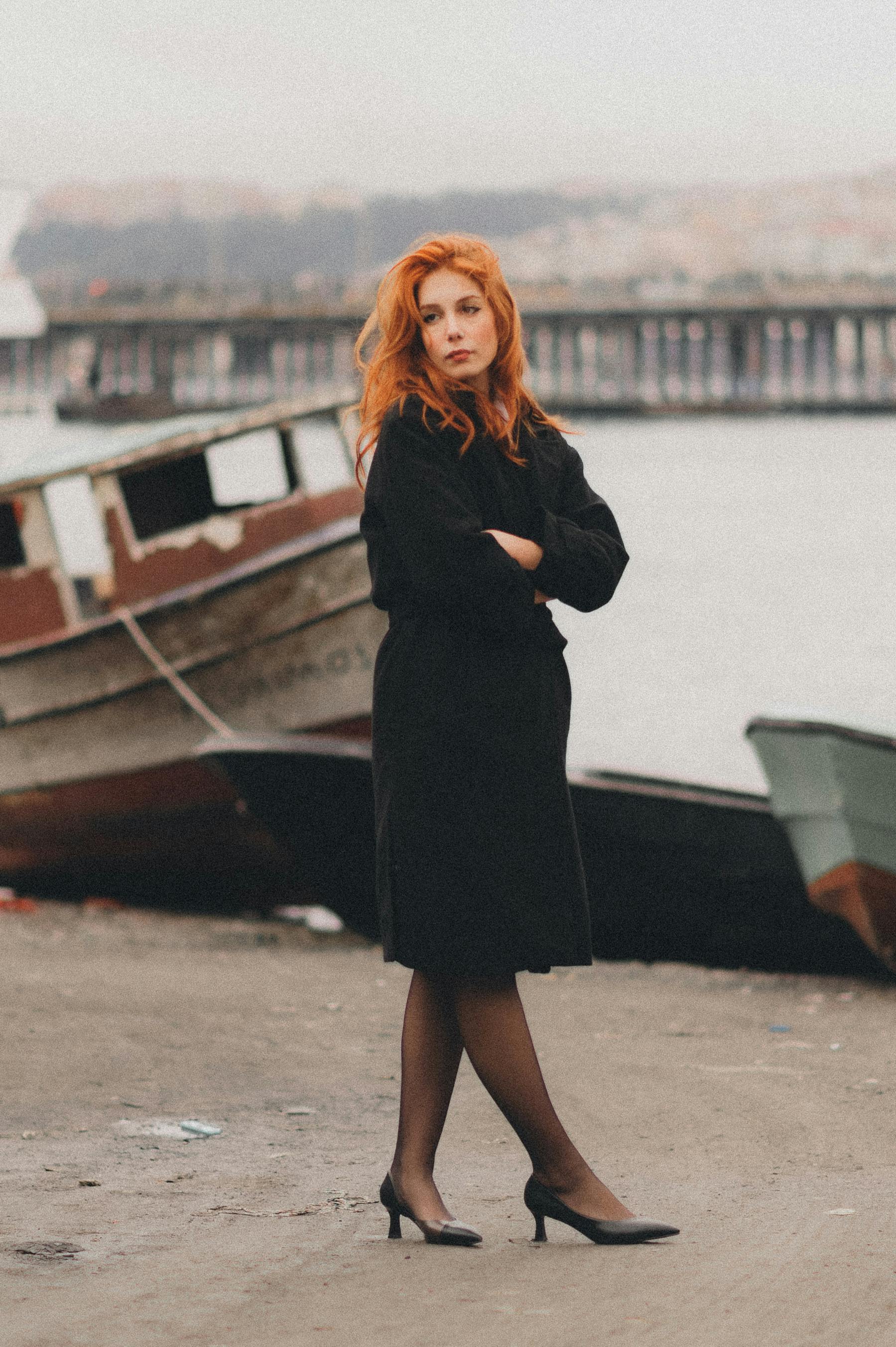 Redhead Woman Bending under Cherry Tree in Spring · Free Stock Photo