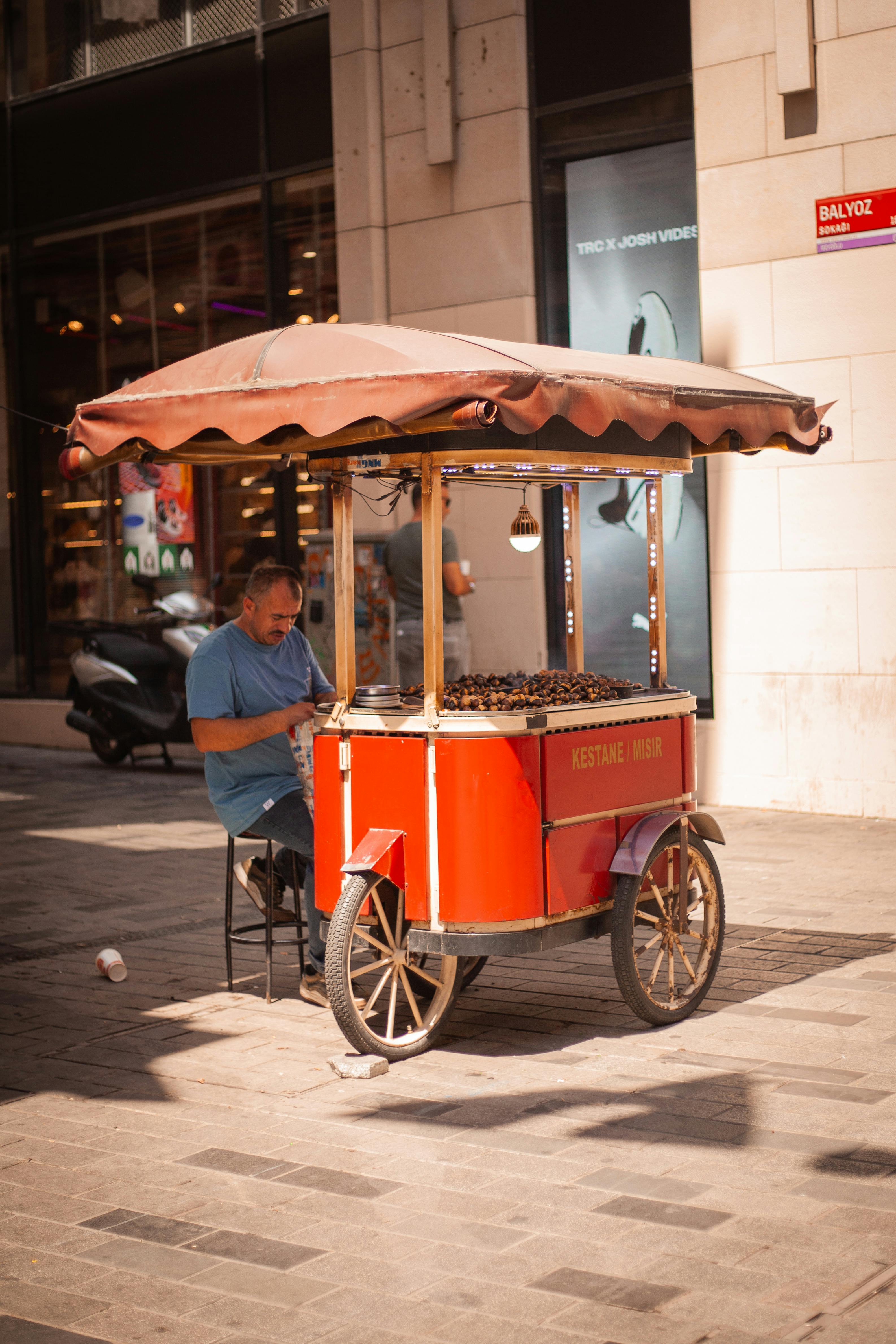Merchant with Cart Selling Food · Free Stock Photo