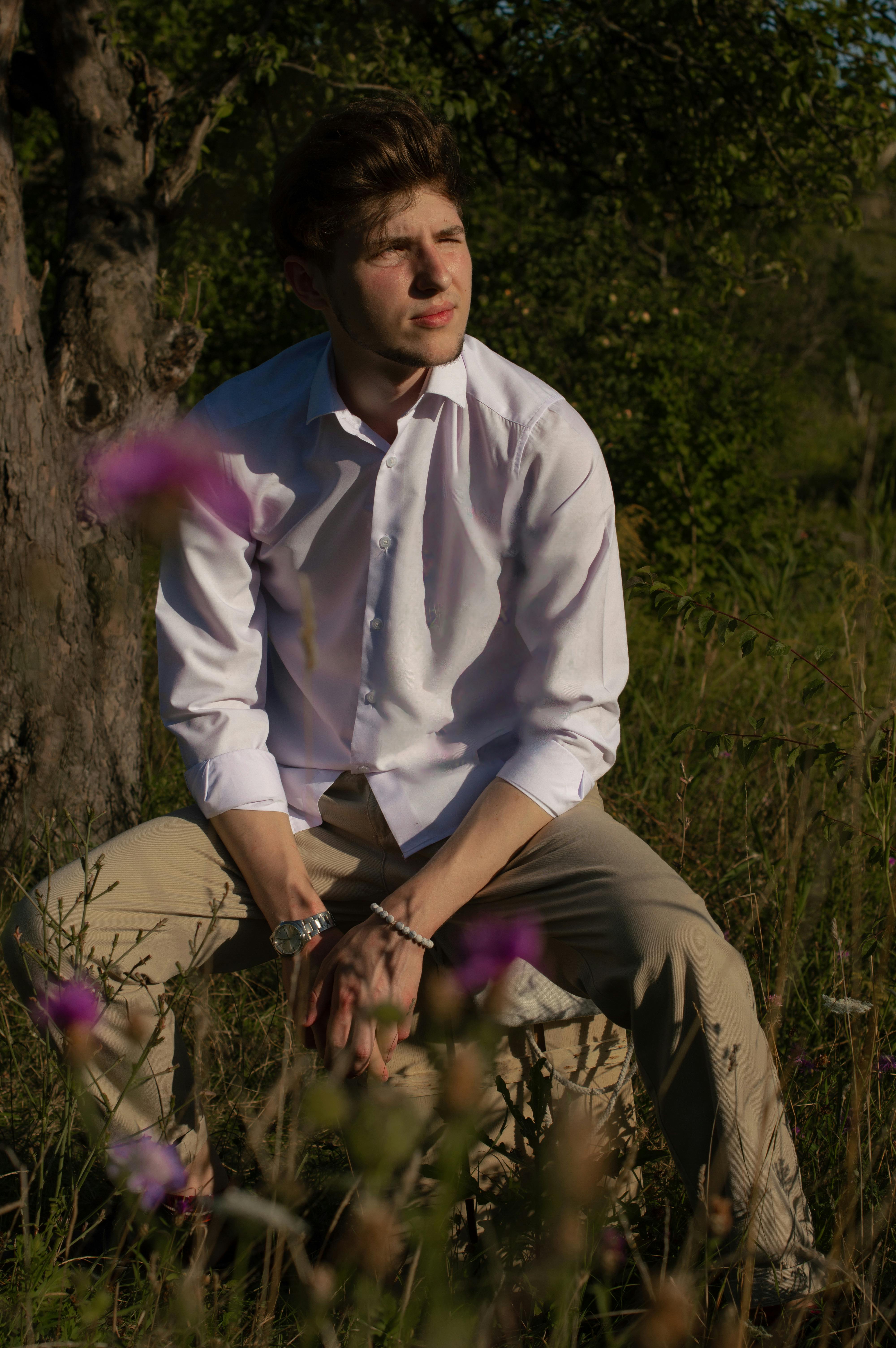 Portrait of Man on Railroad Tracks · Free Stock Photo