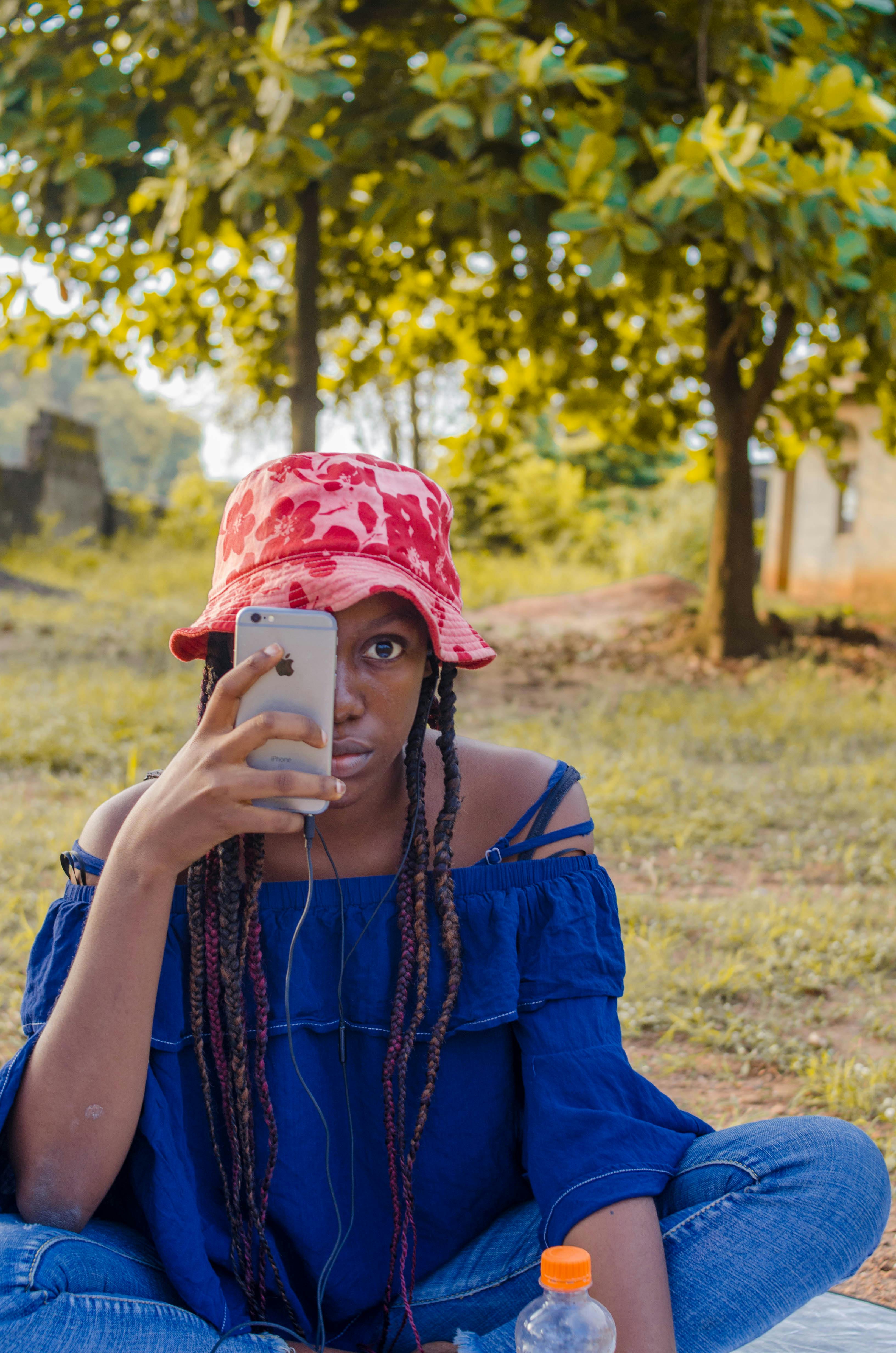 Woman Posing with Smartphone · Free Stock Photo