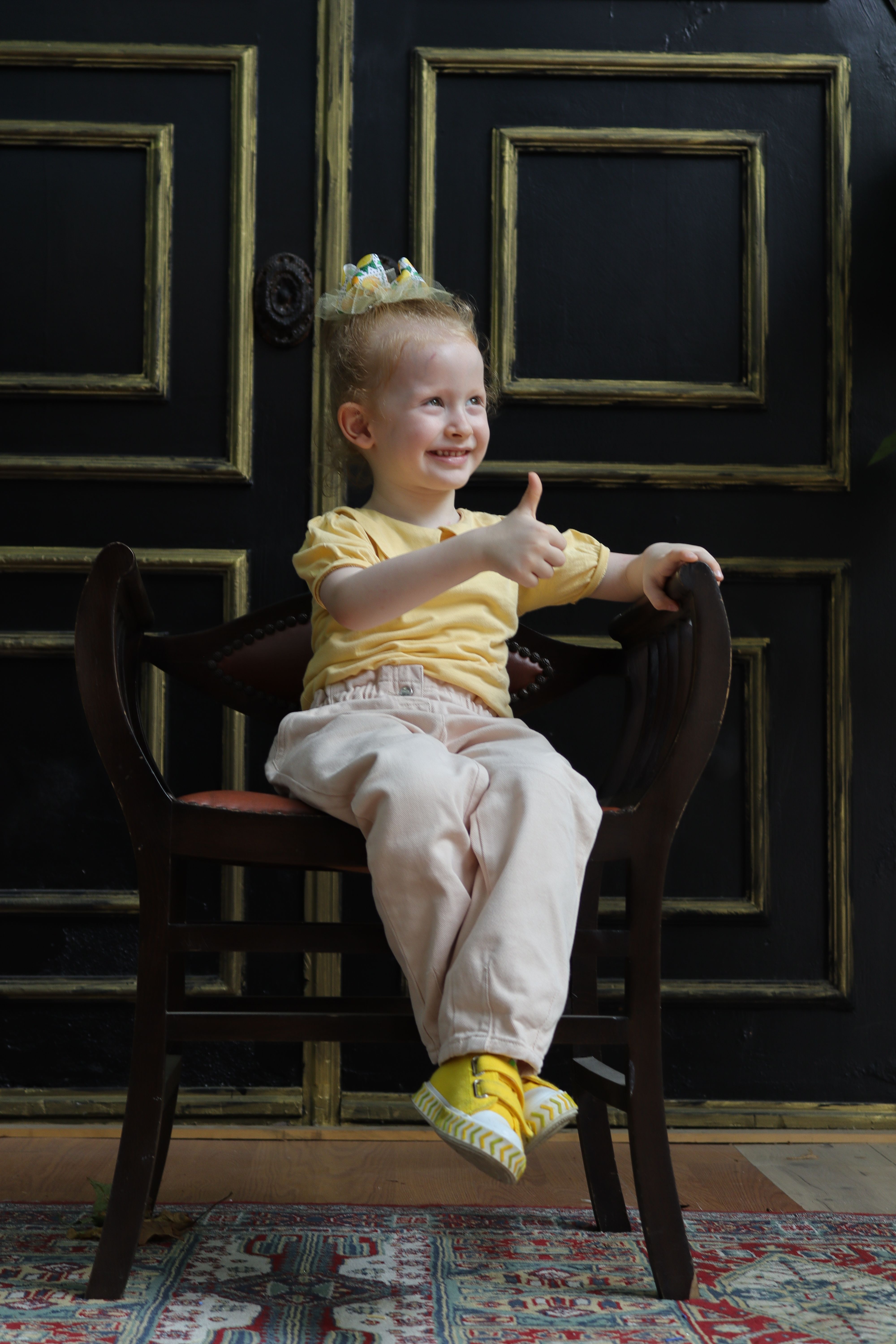 Smiling Blonde Child on Chair · Free Stock Photo