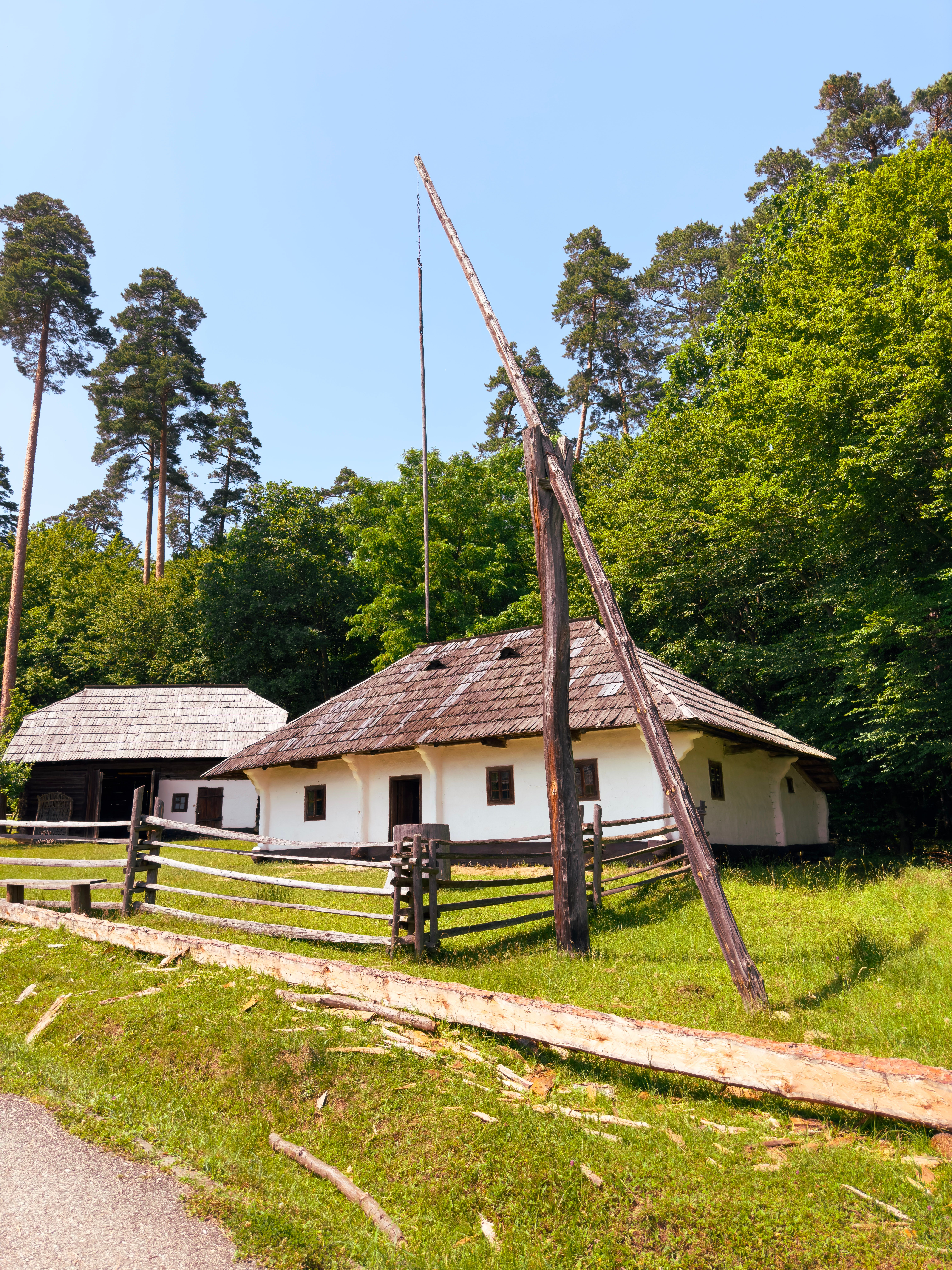 A wooden house with a pole in front of it · Free Stock Photo