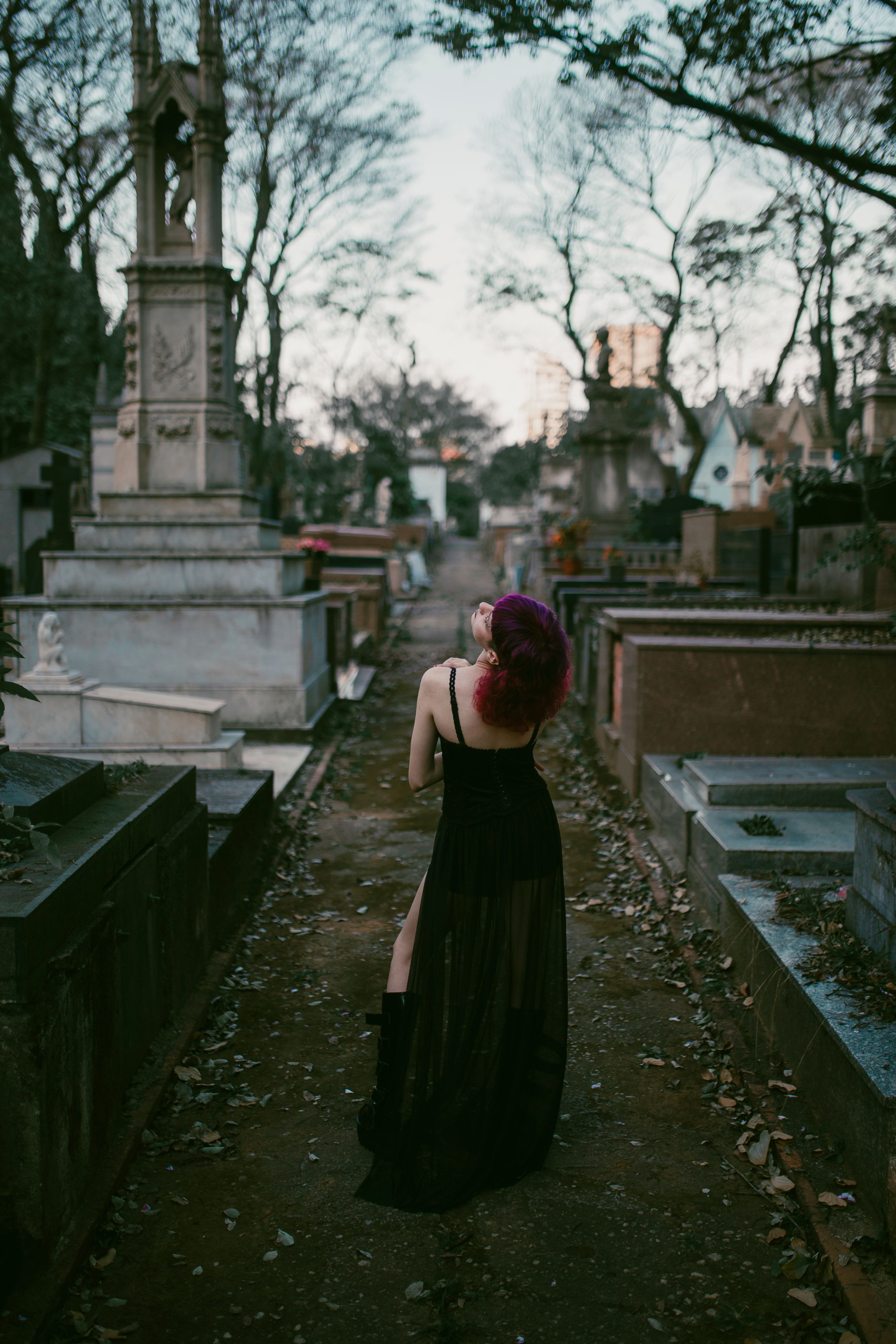Redhead Woman in Dress Posing on Cemetery · Free Stock Photo