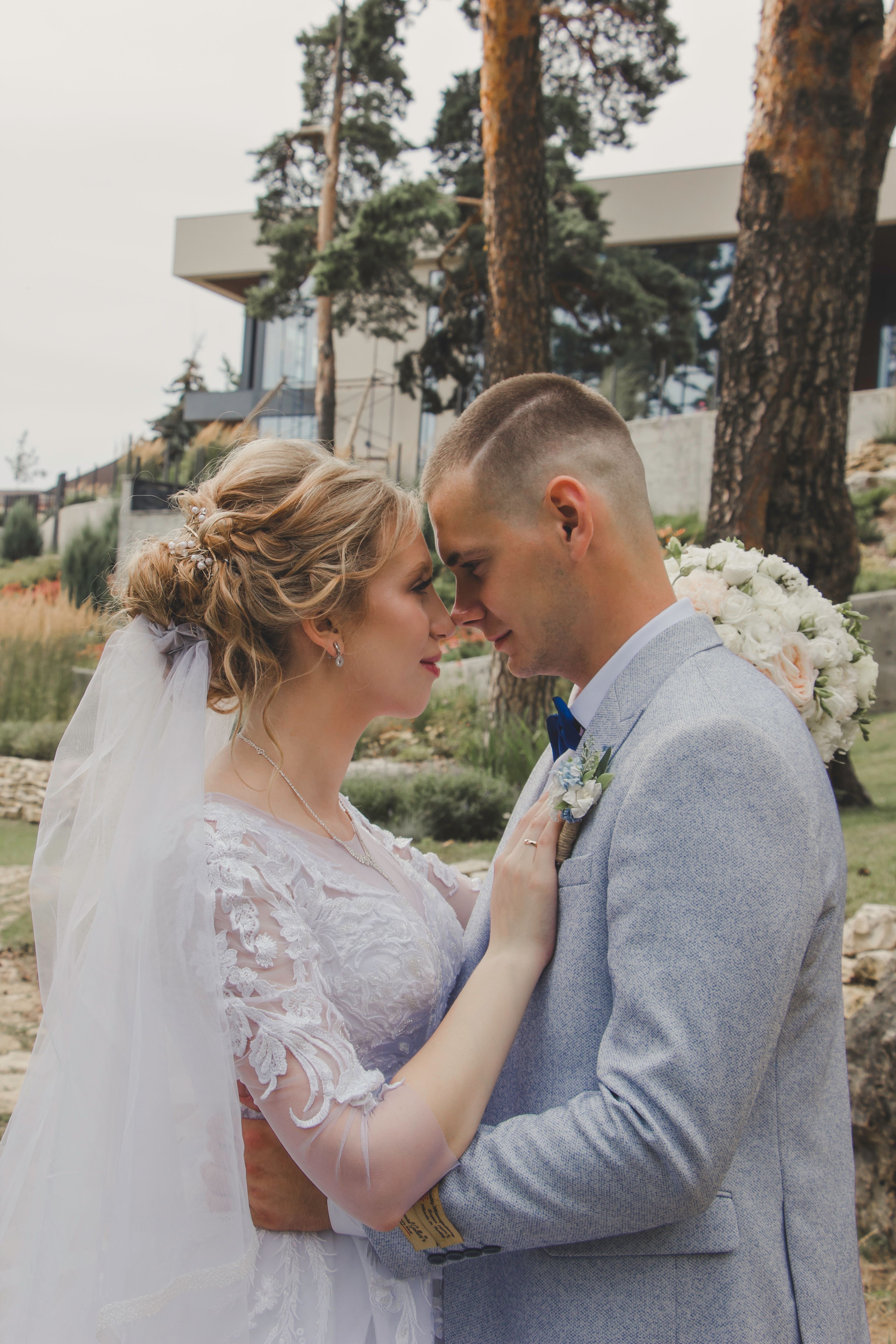 Bride and Groom Hugging on Wedding Celebration · Free Stock Photo