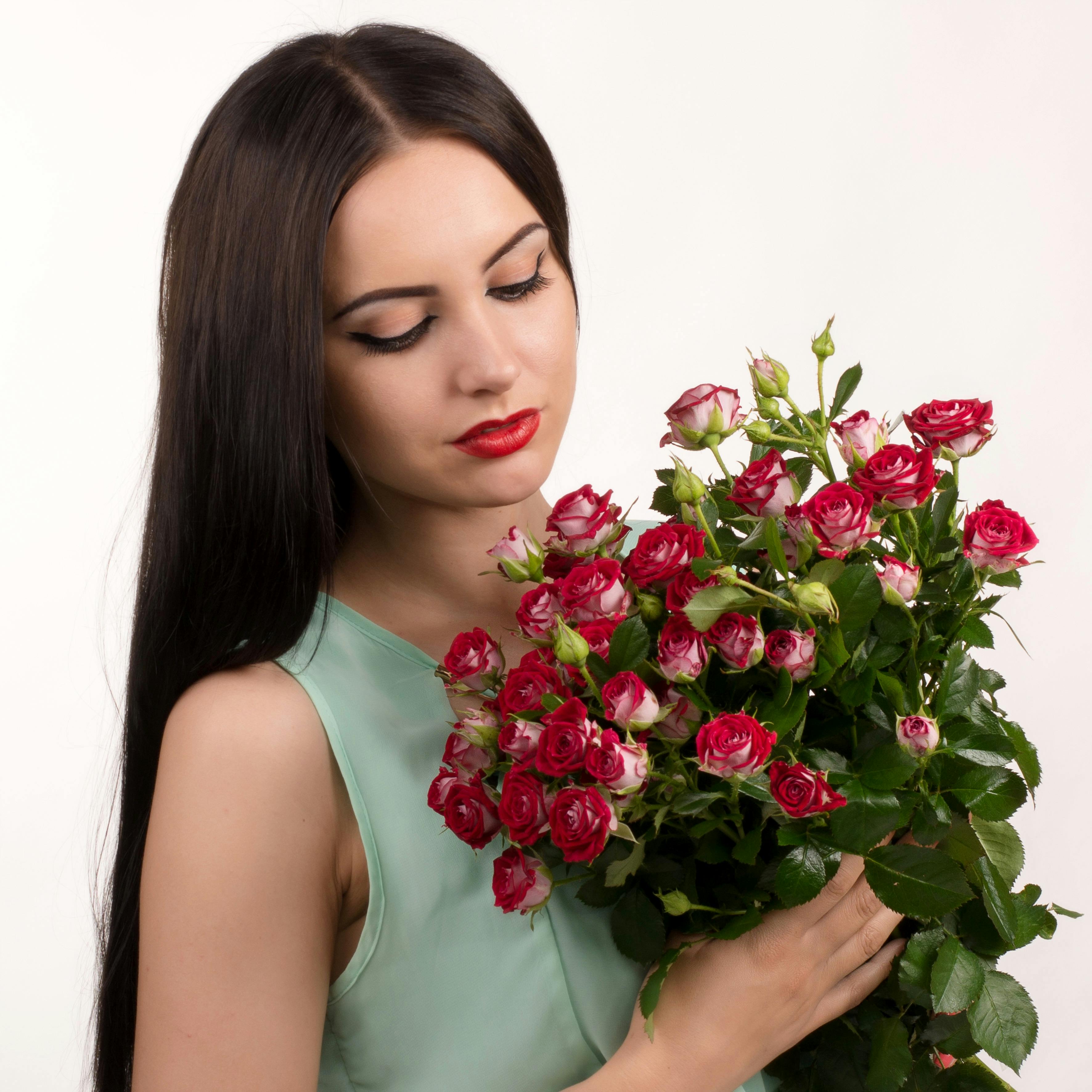 Young Woman with Roses Flowers on White Background · Free Stock Photo
