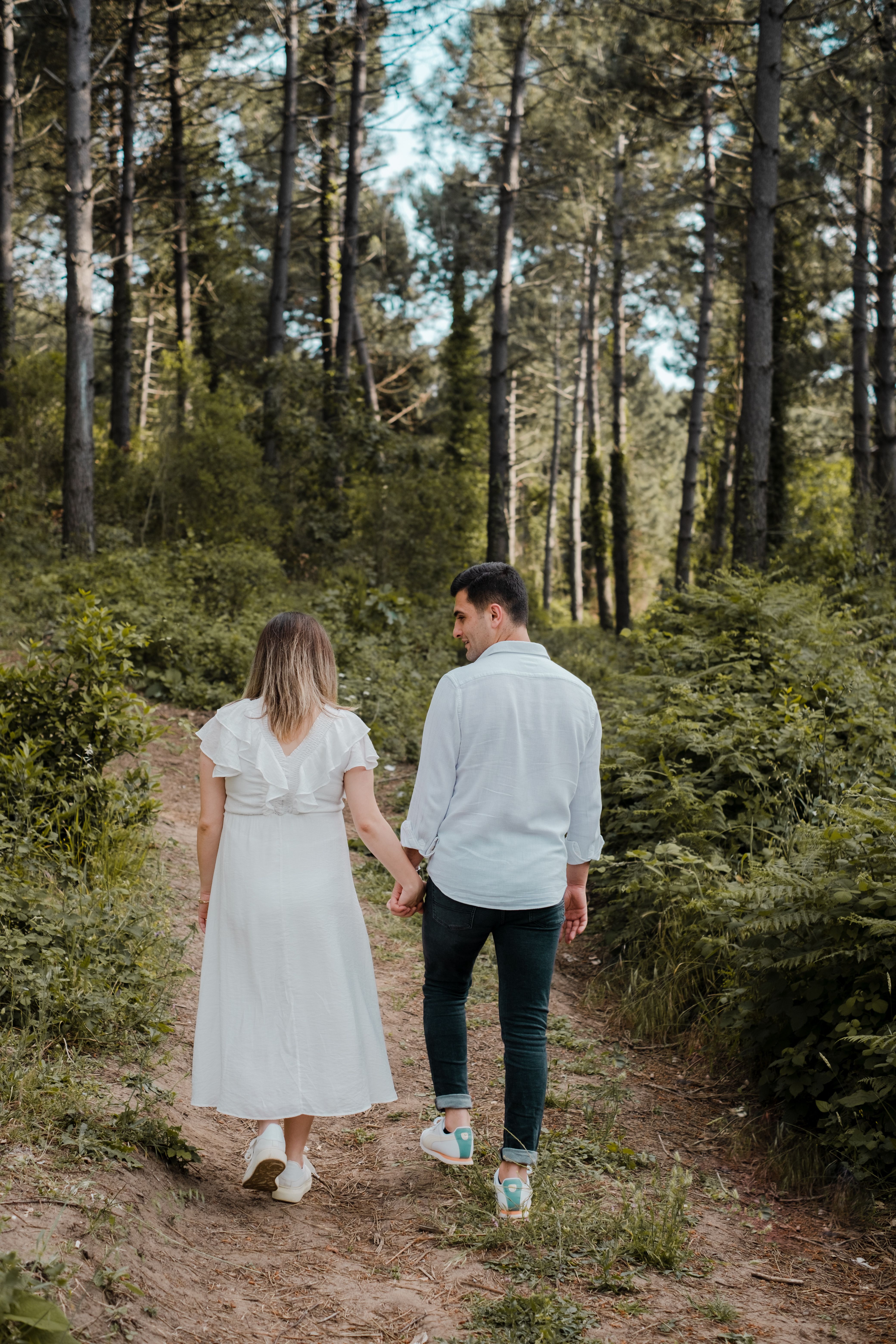Couple Walking in a Forest · Free Stock Photo
