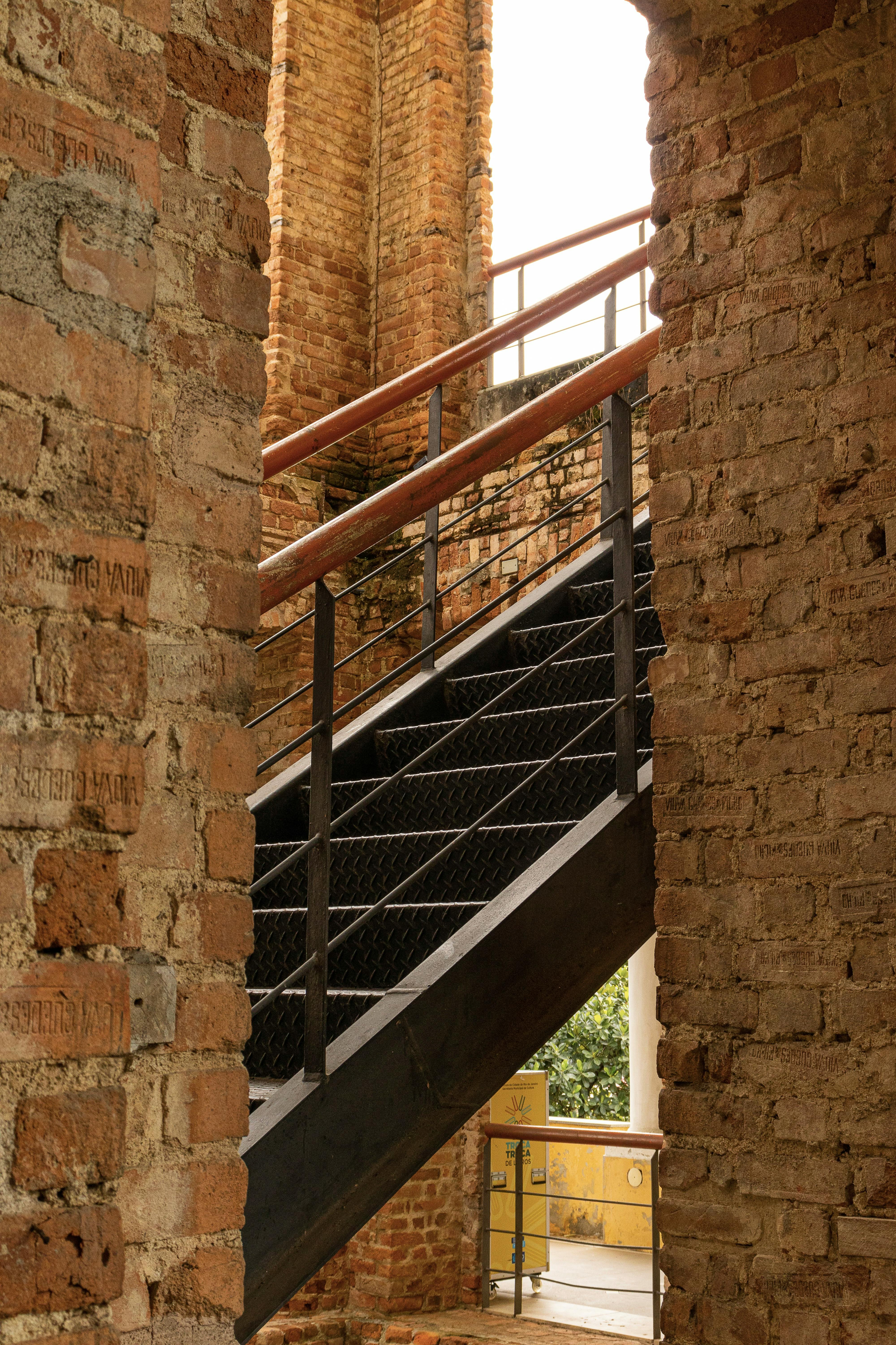 Stone Walls around Metal Stairs · Free Stock Photo