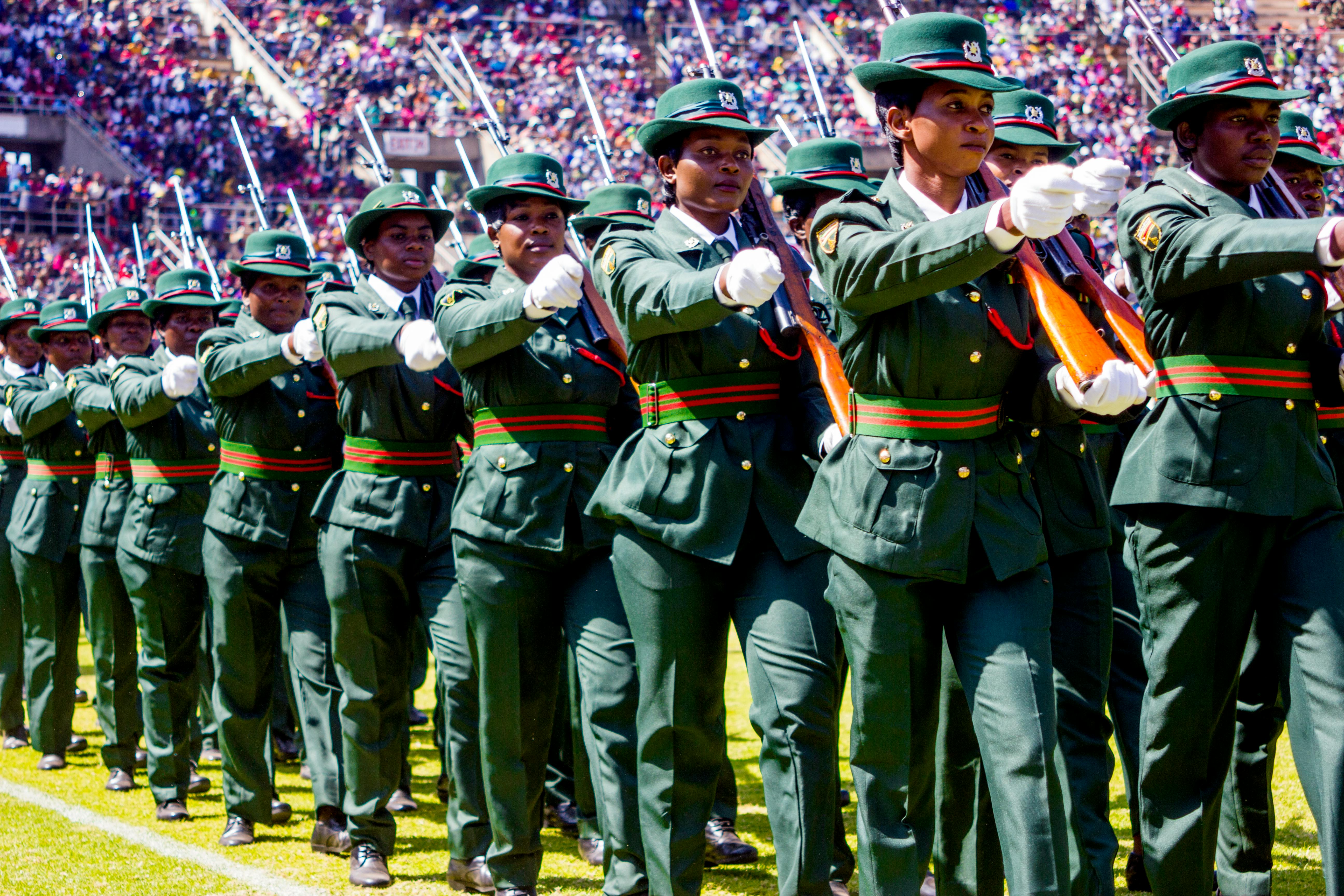 Women in Official Army Uniforms Marching on a Football Stadium · Free ...