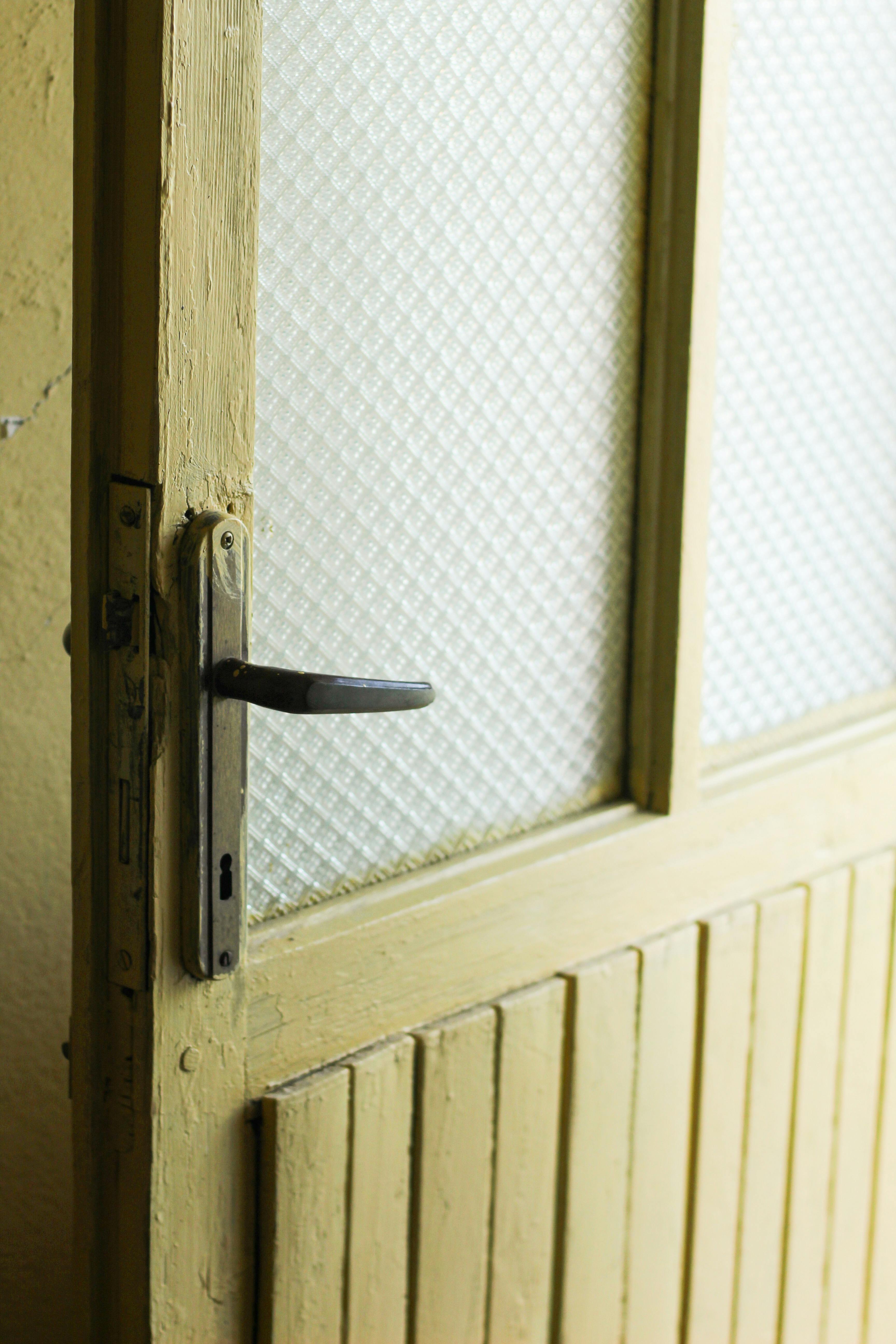 A Steel Framed Glass Structure with Table and Chairs · Free Stock Photo