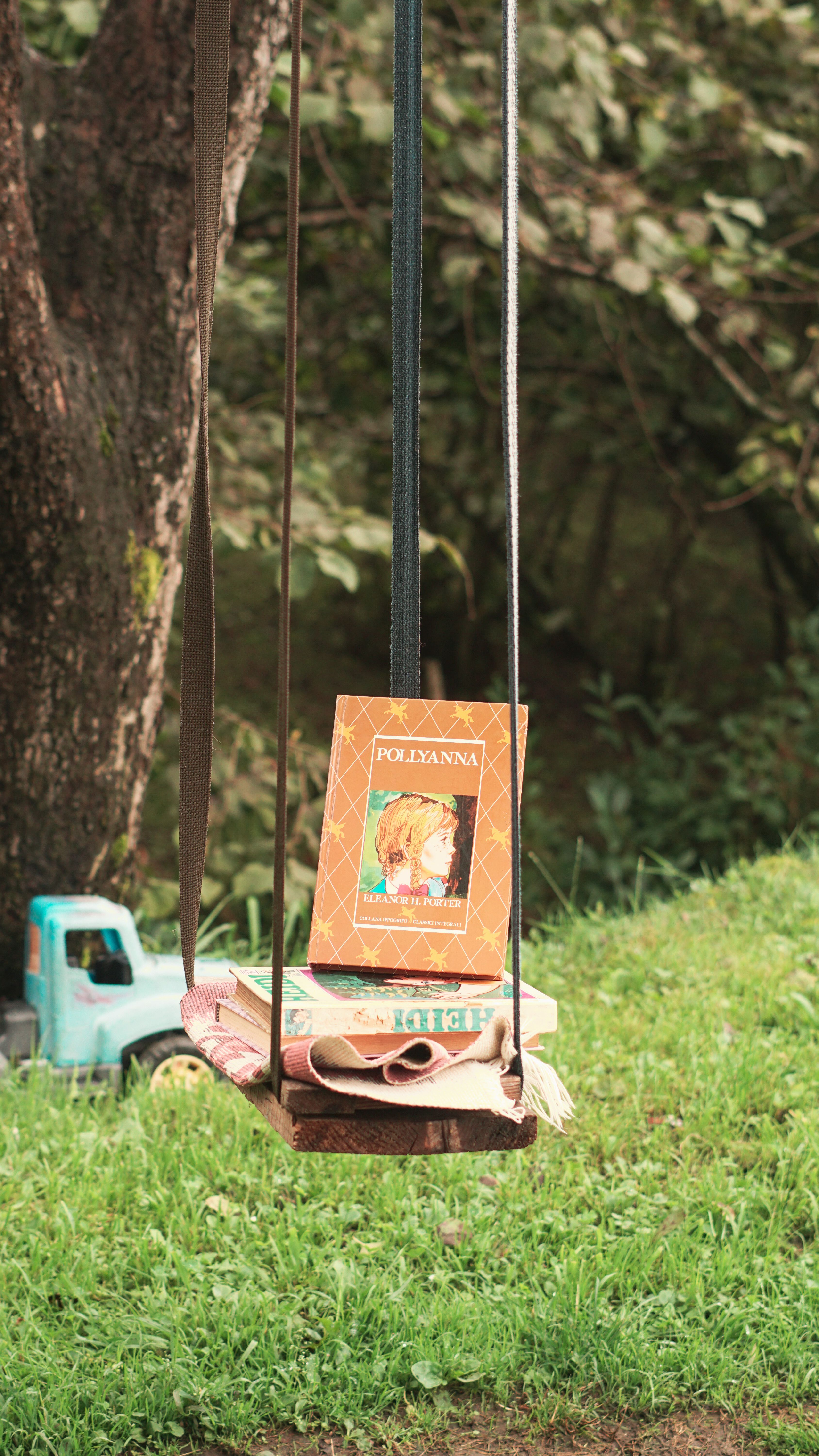 A swing with a book on it and a truck · Free Stock Photo