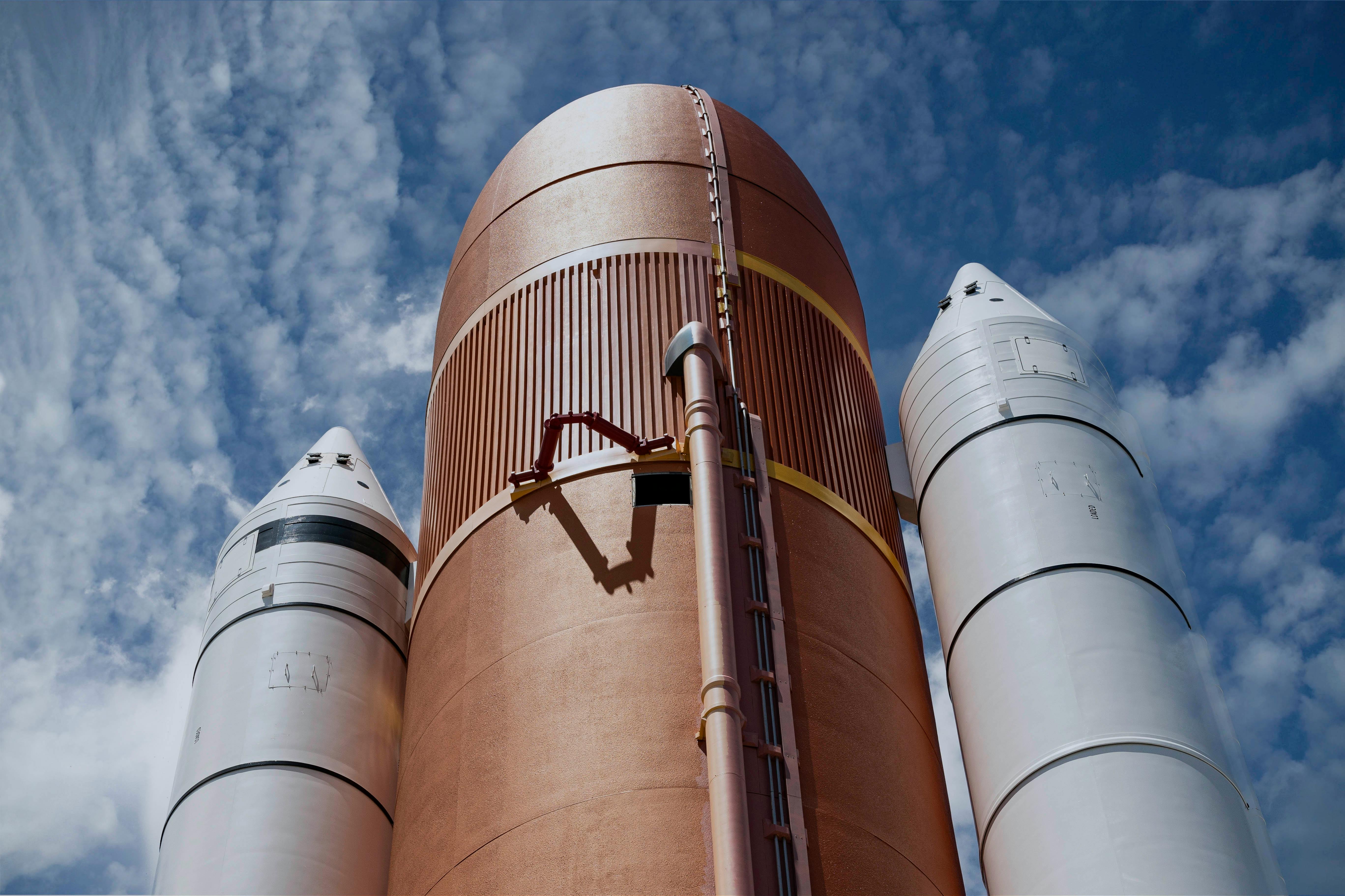 Assembly of rocket core at aerospace factory · Free Stock Photo