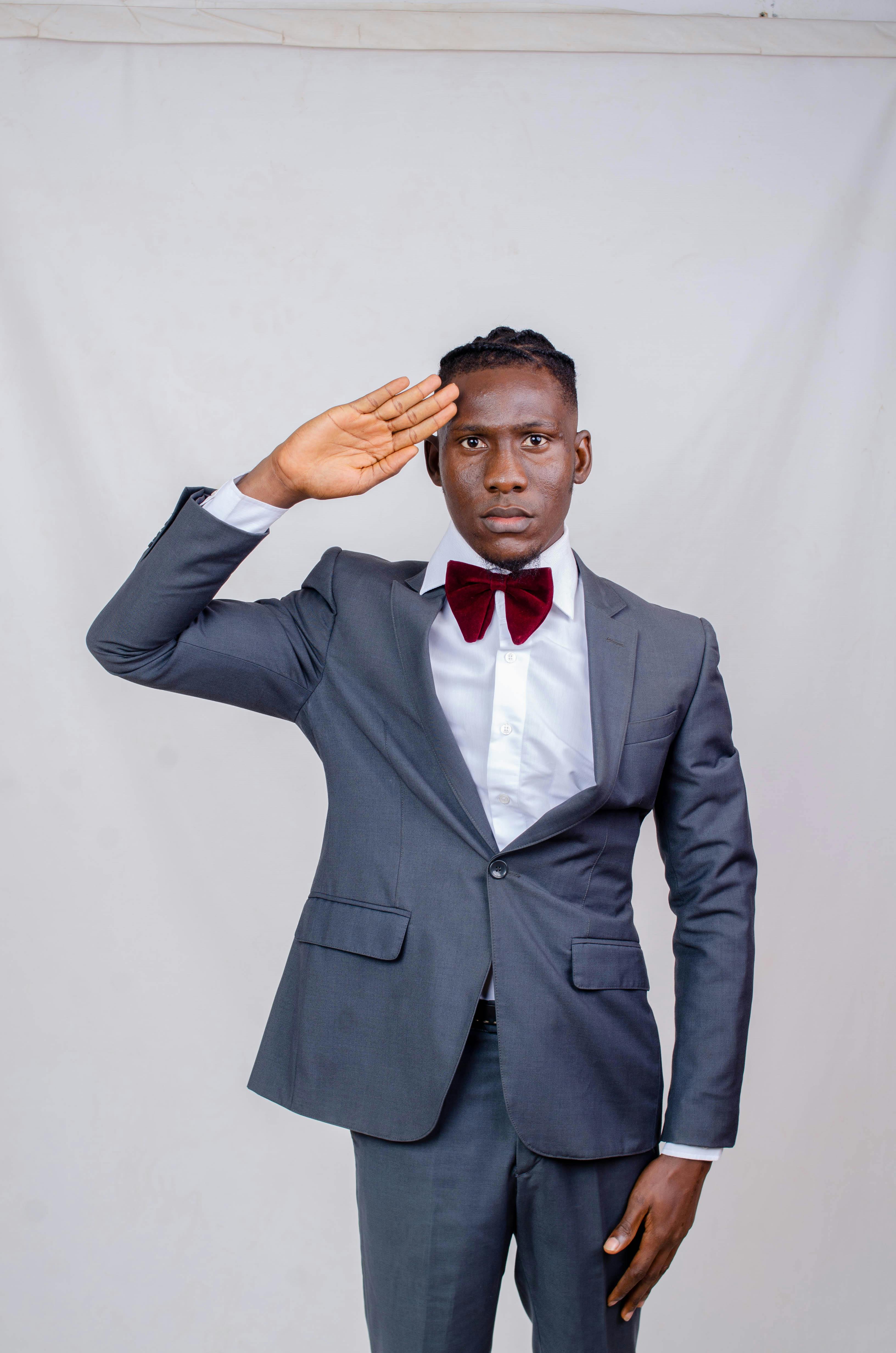 Saluting Model in Suit · Free Stock Photo