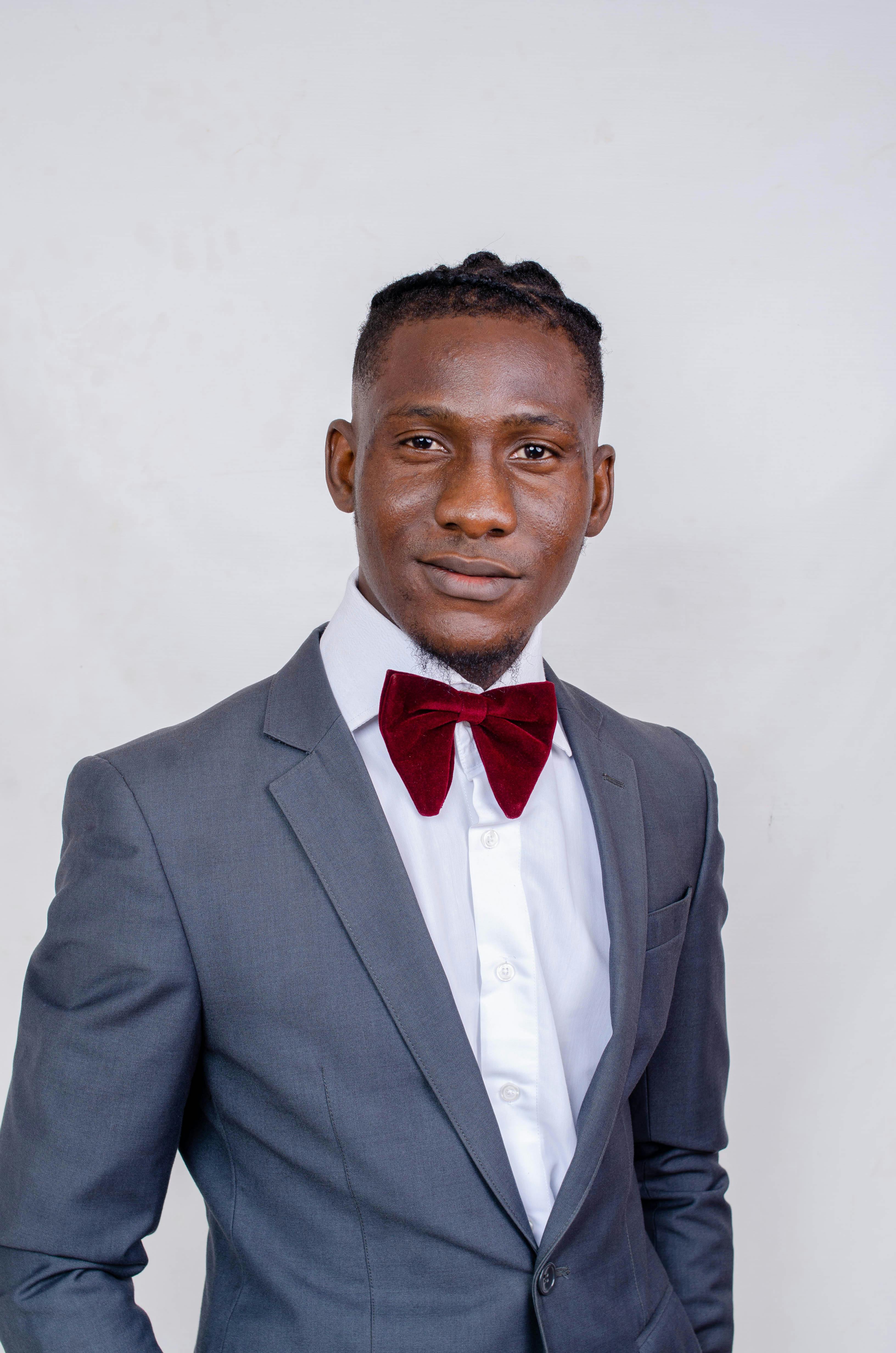 Handsome Clean Shaved Man in Suit with Untied Bow Tie · Free Stock Photo
