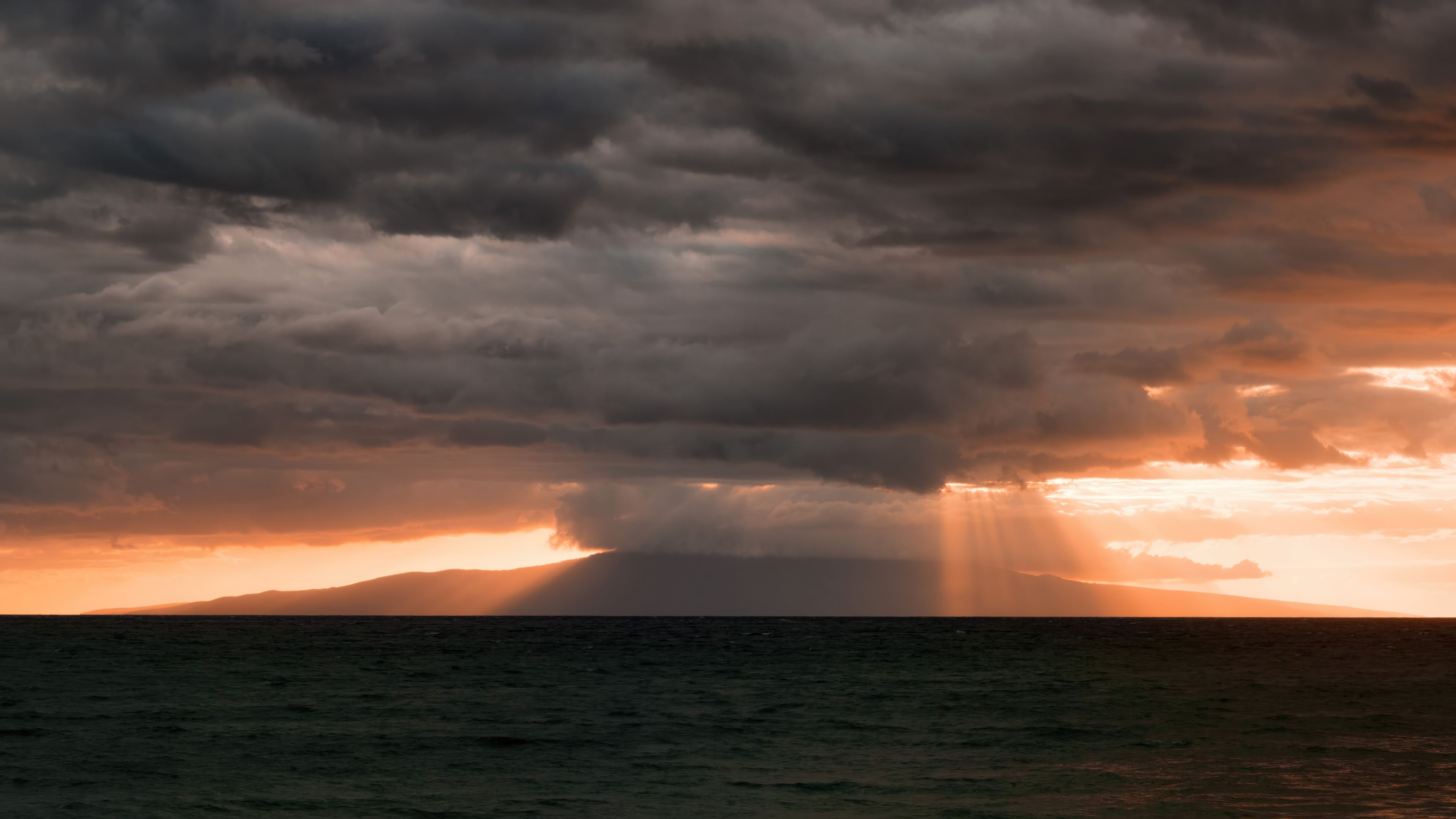 Rain Clouds and Sunbeams over Sea at Sunset · Free Stock Photo