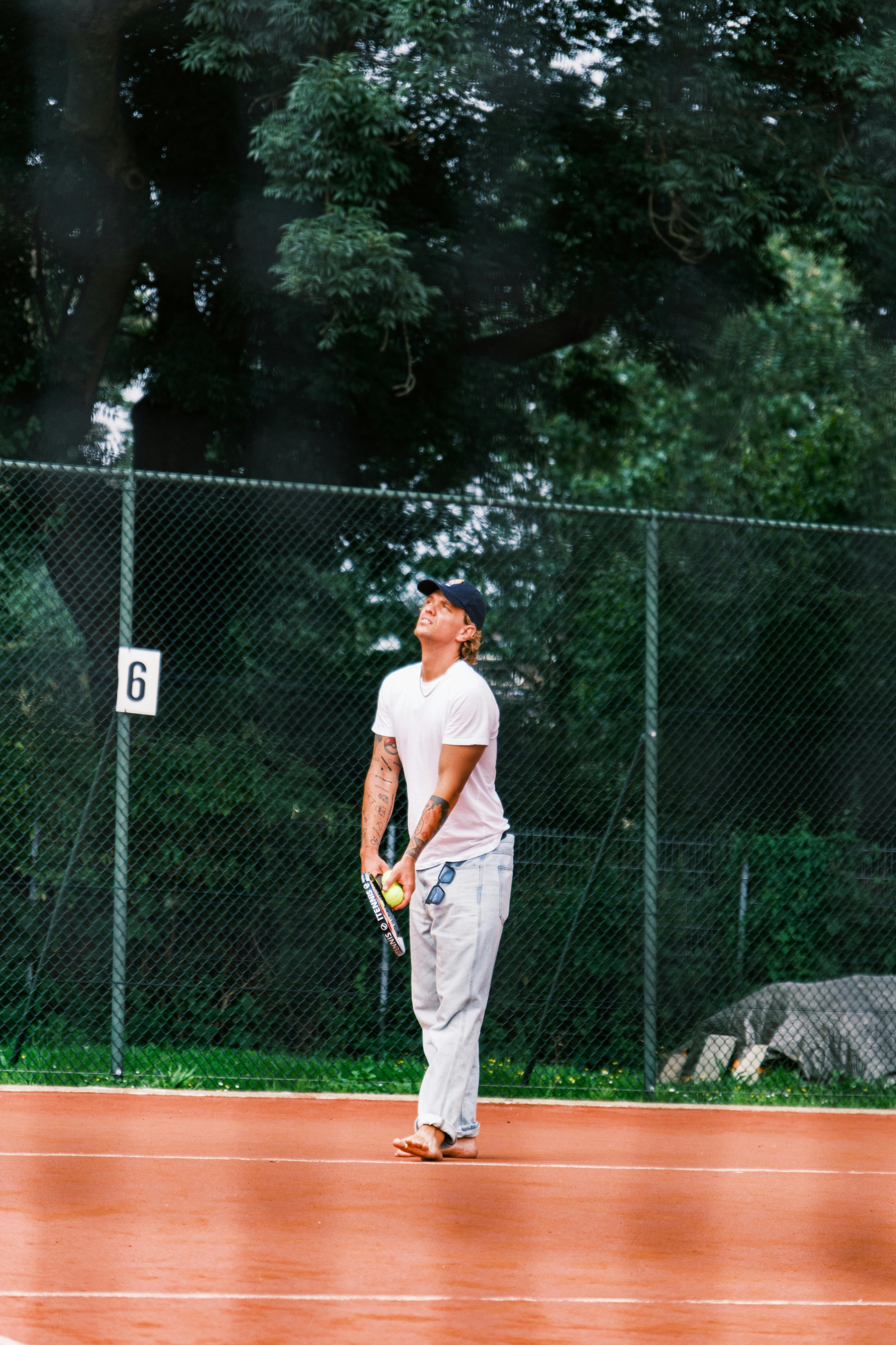 Tennis Player before a Serve · Free Stock Photo