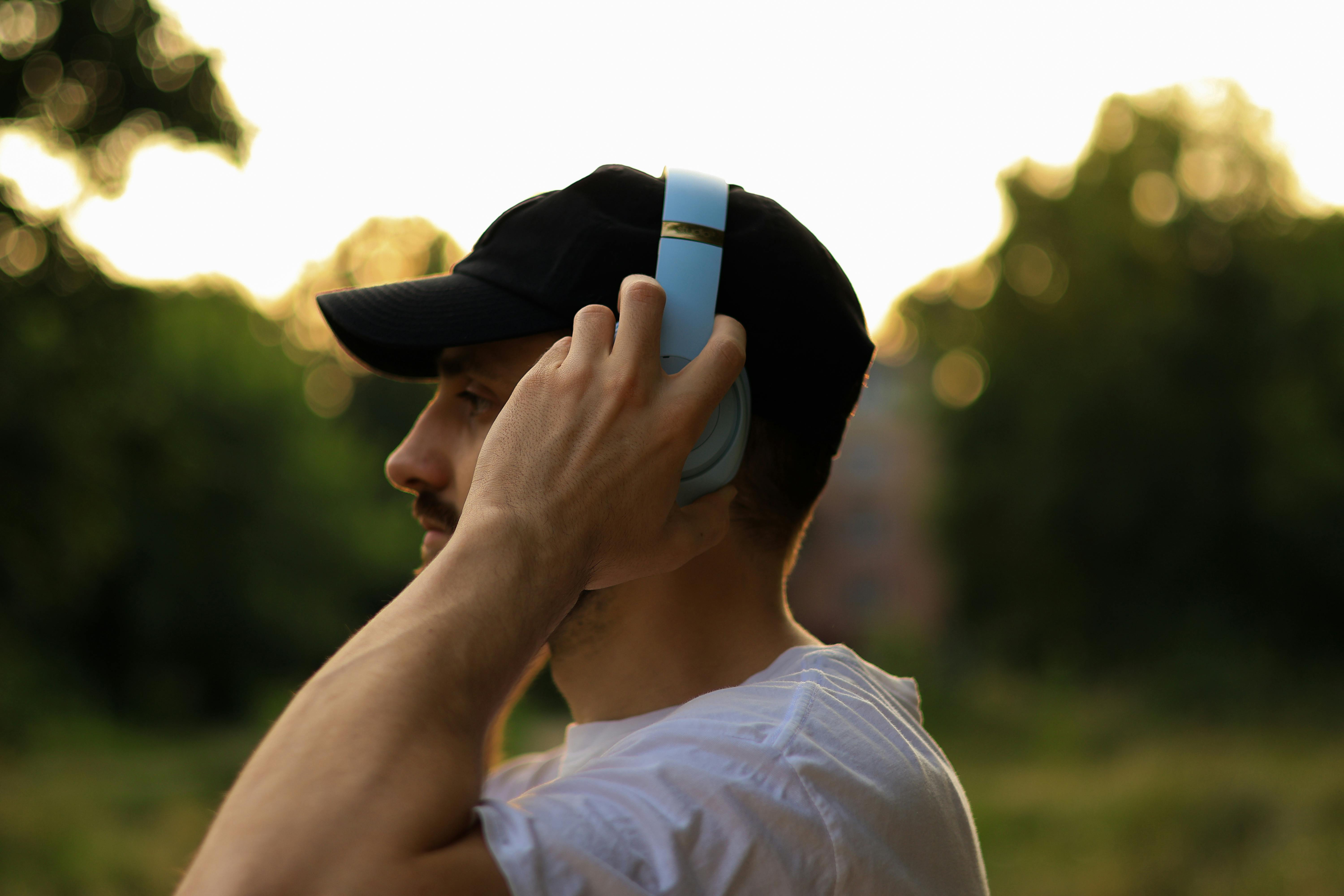 Man in Cap and Headphones · Free Stock Photo