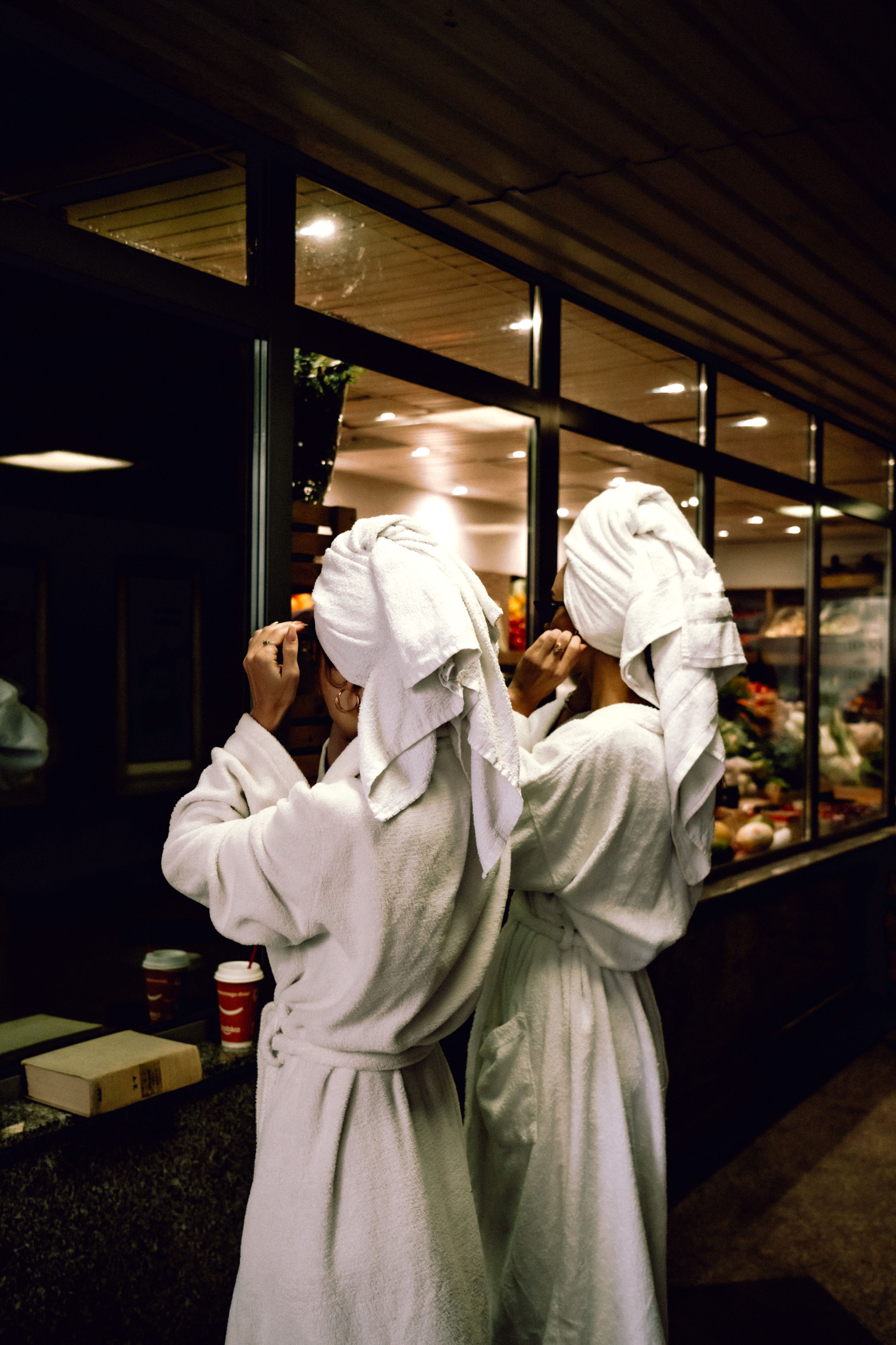 Women in Bathrobes Standing in Store · Free Stock Photo