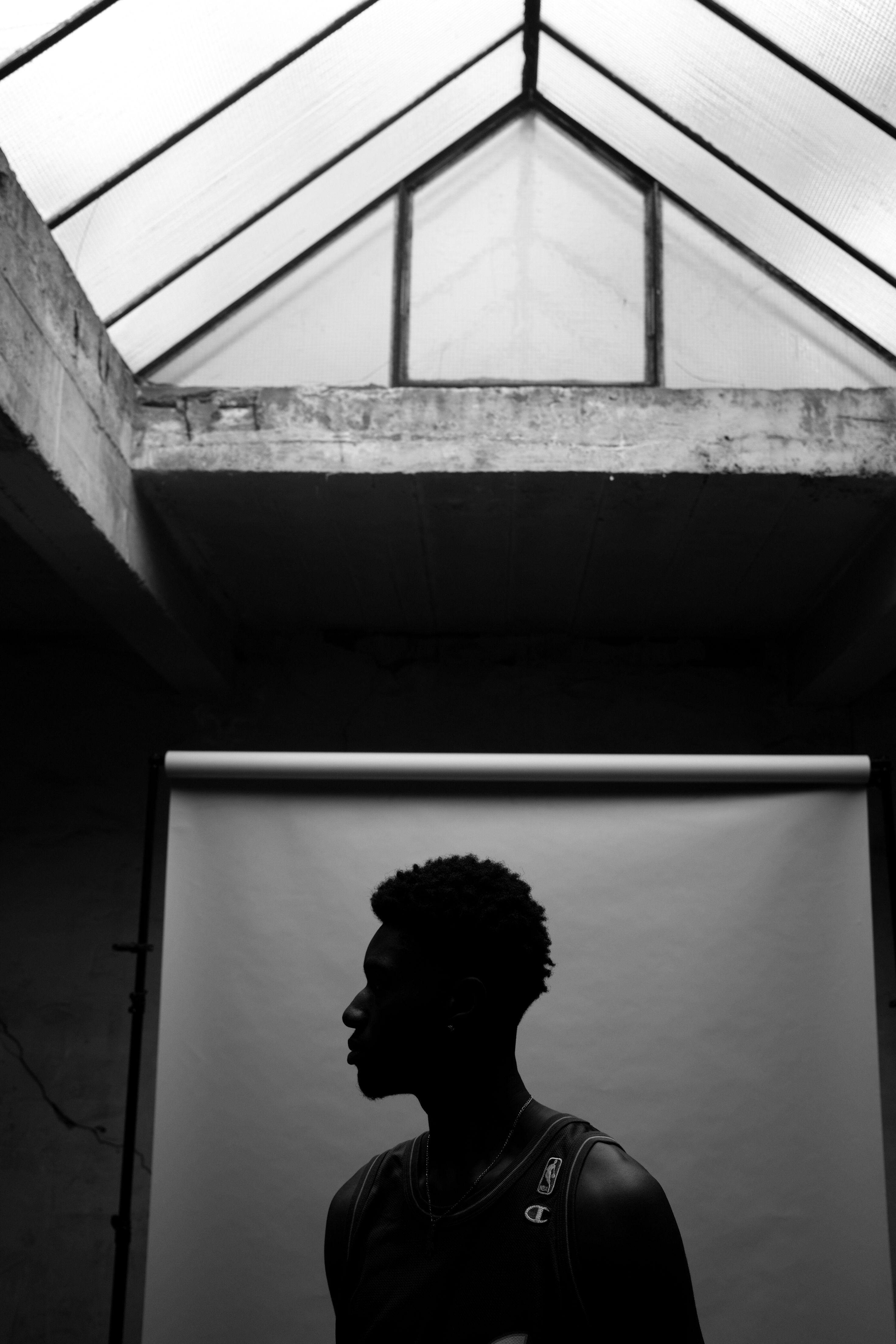 Man Standing in Studio with Skylight · Free Stock Photo