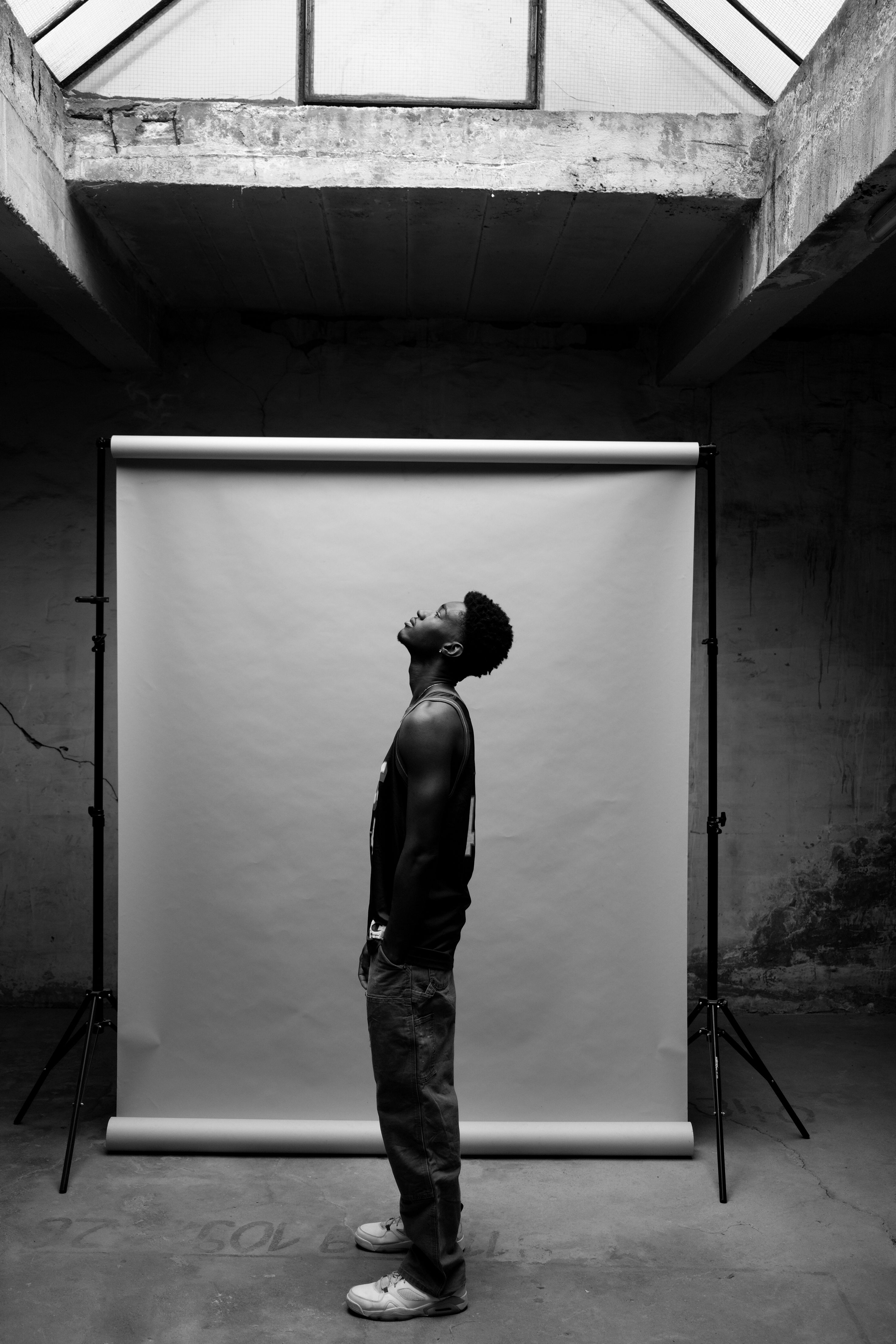 Man Standing in Studio and Looking Up · Free Stock Photo