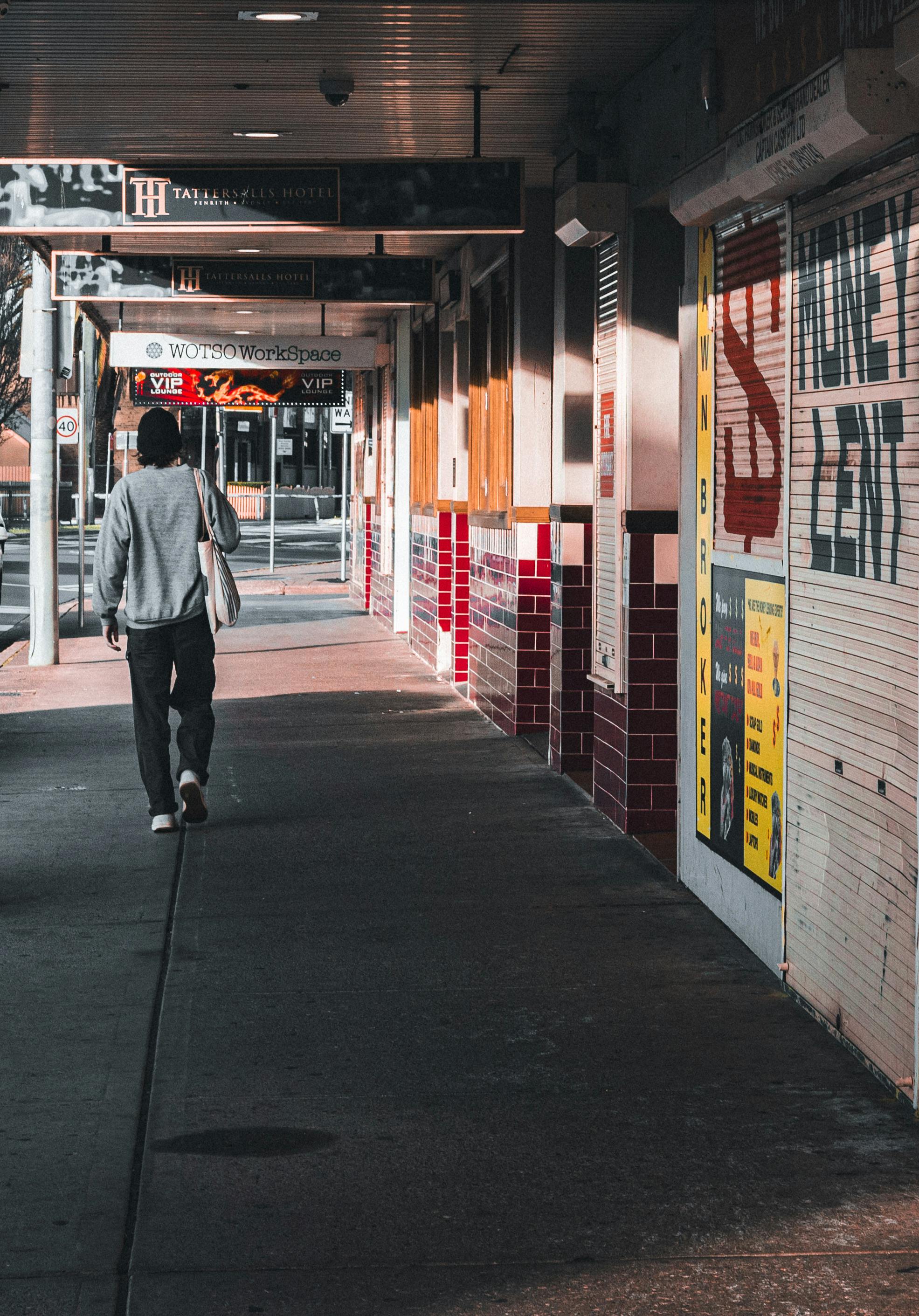 Back View of a Pedestrian on the Street in City · Free Stock Photo