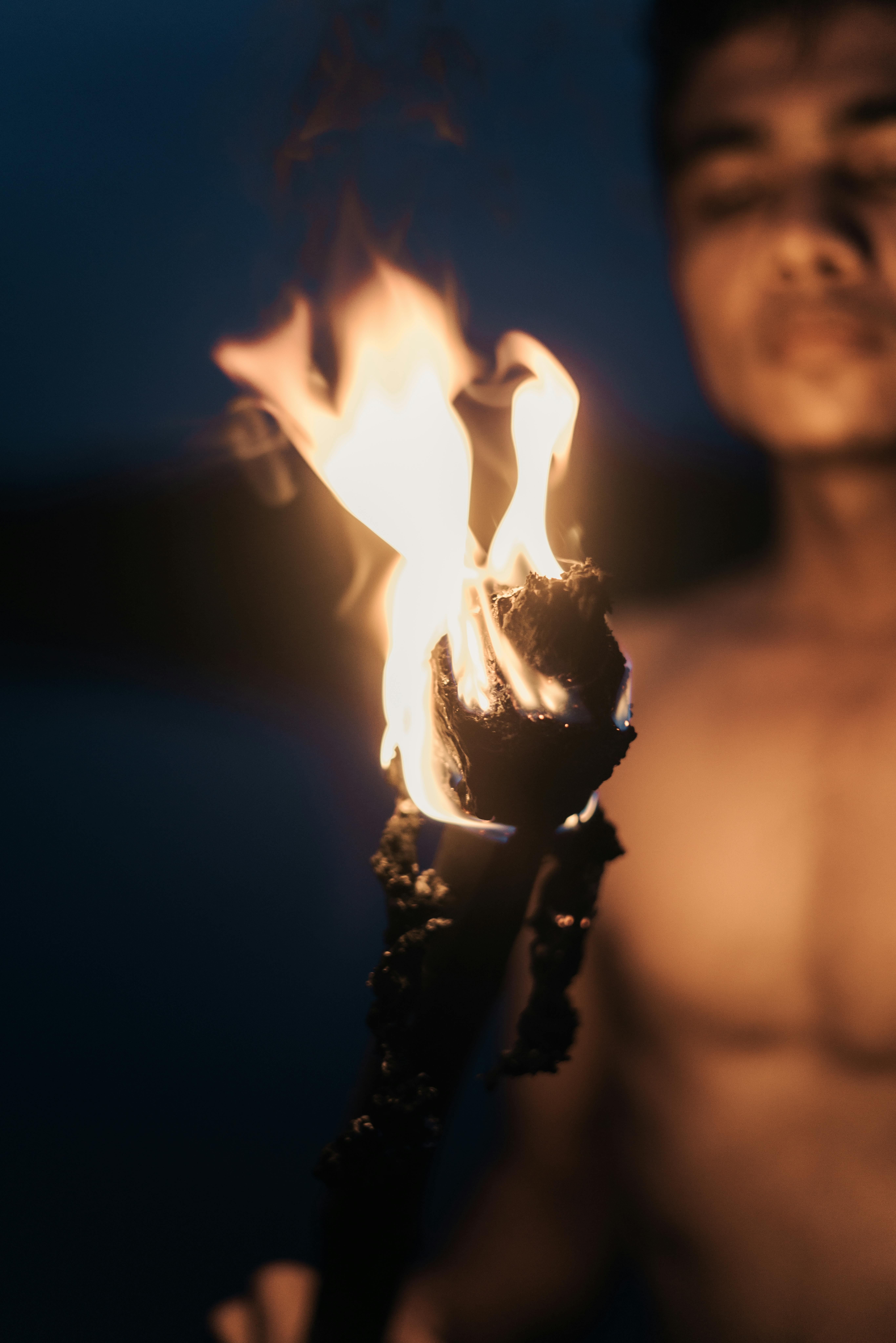 Man Holding Fire Torch Photos, Download The BEST Free Man Holding Fire ...