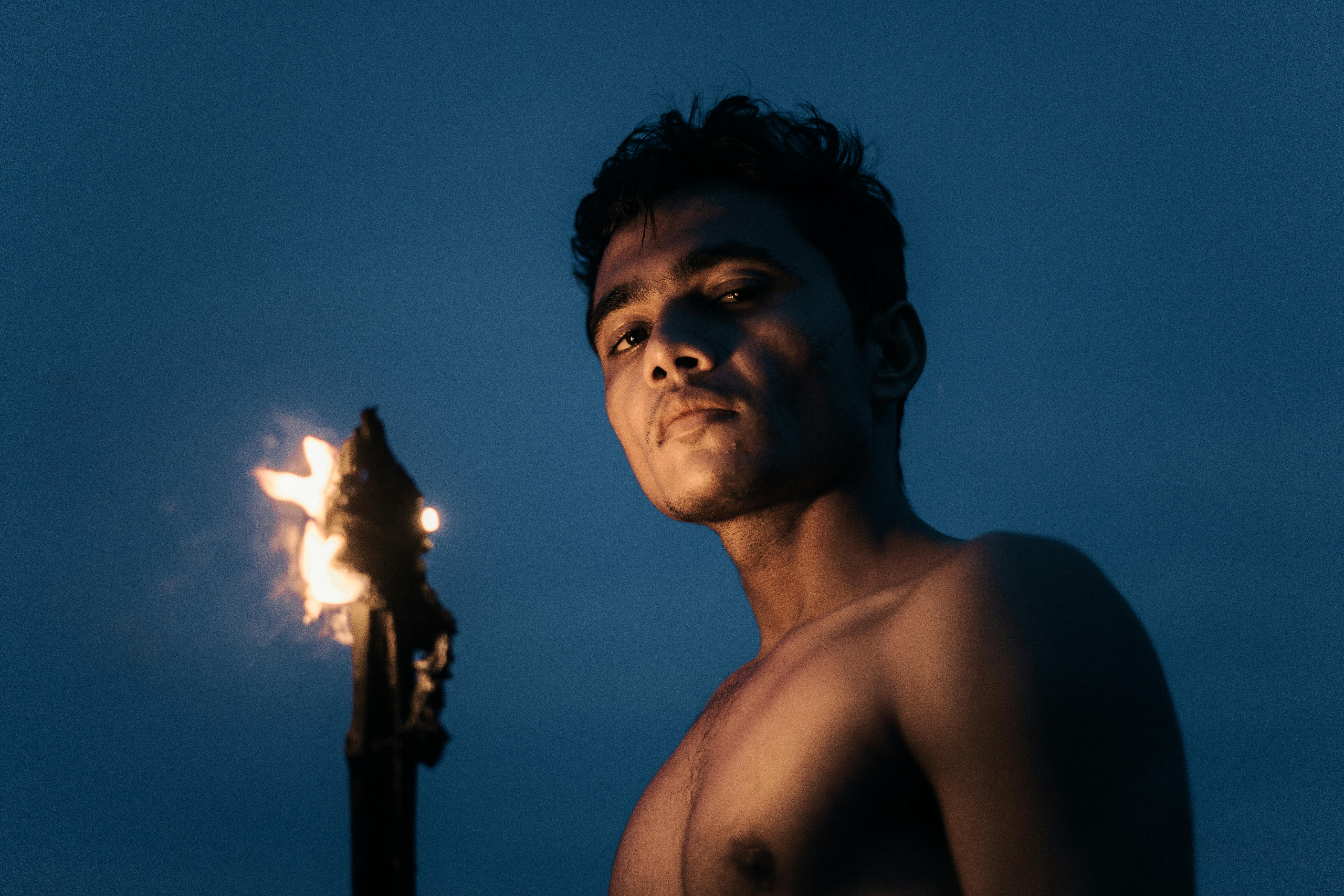 Man with Torch in Evening · Free Stock Photo